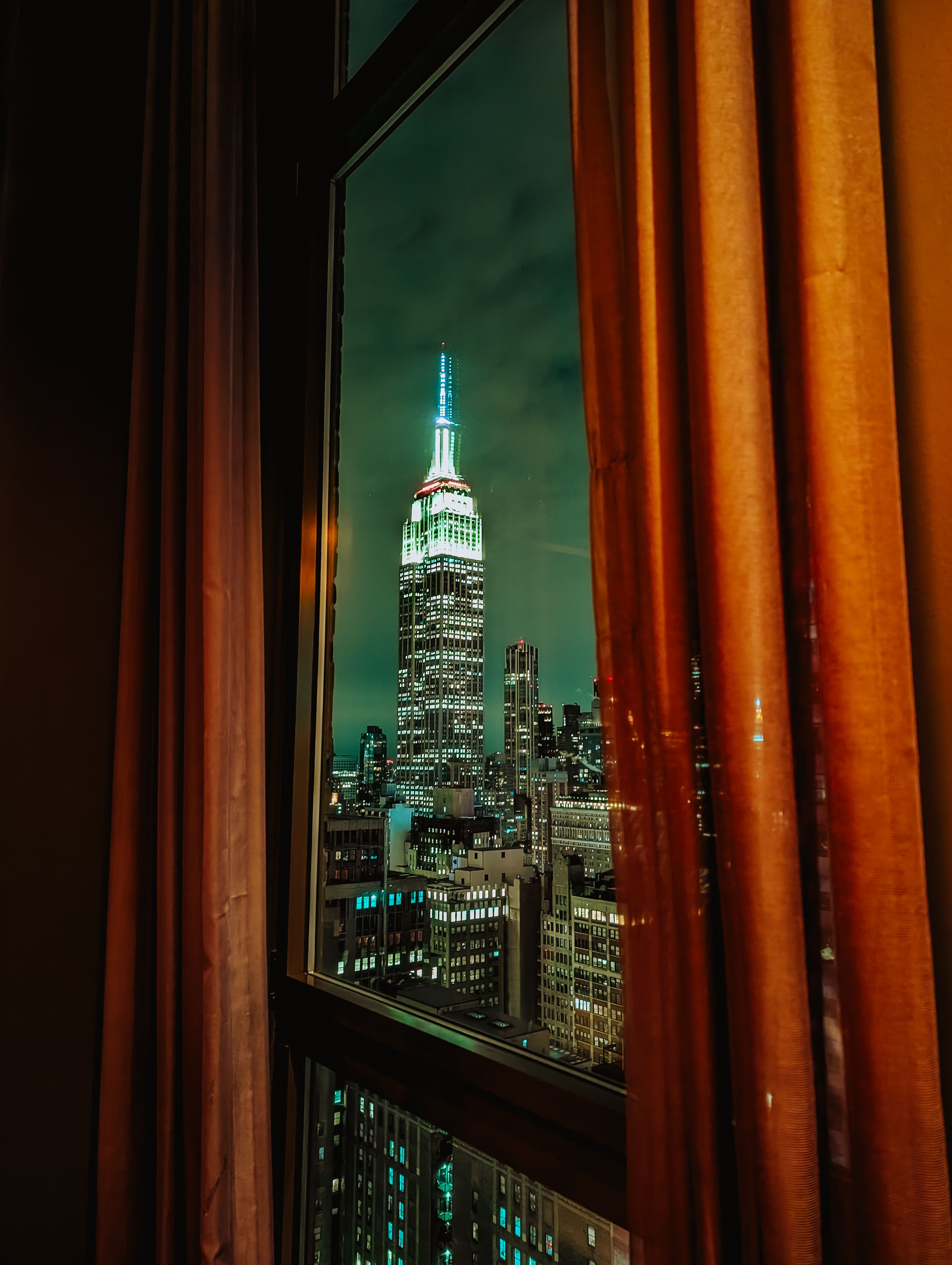 Empire State Building Through New York City Window · Free Stock Photo