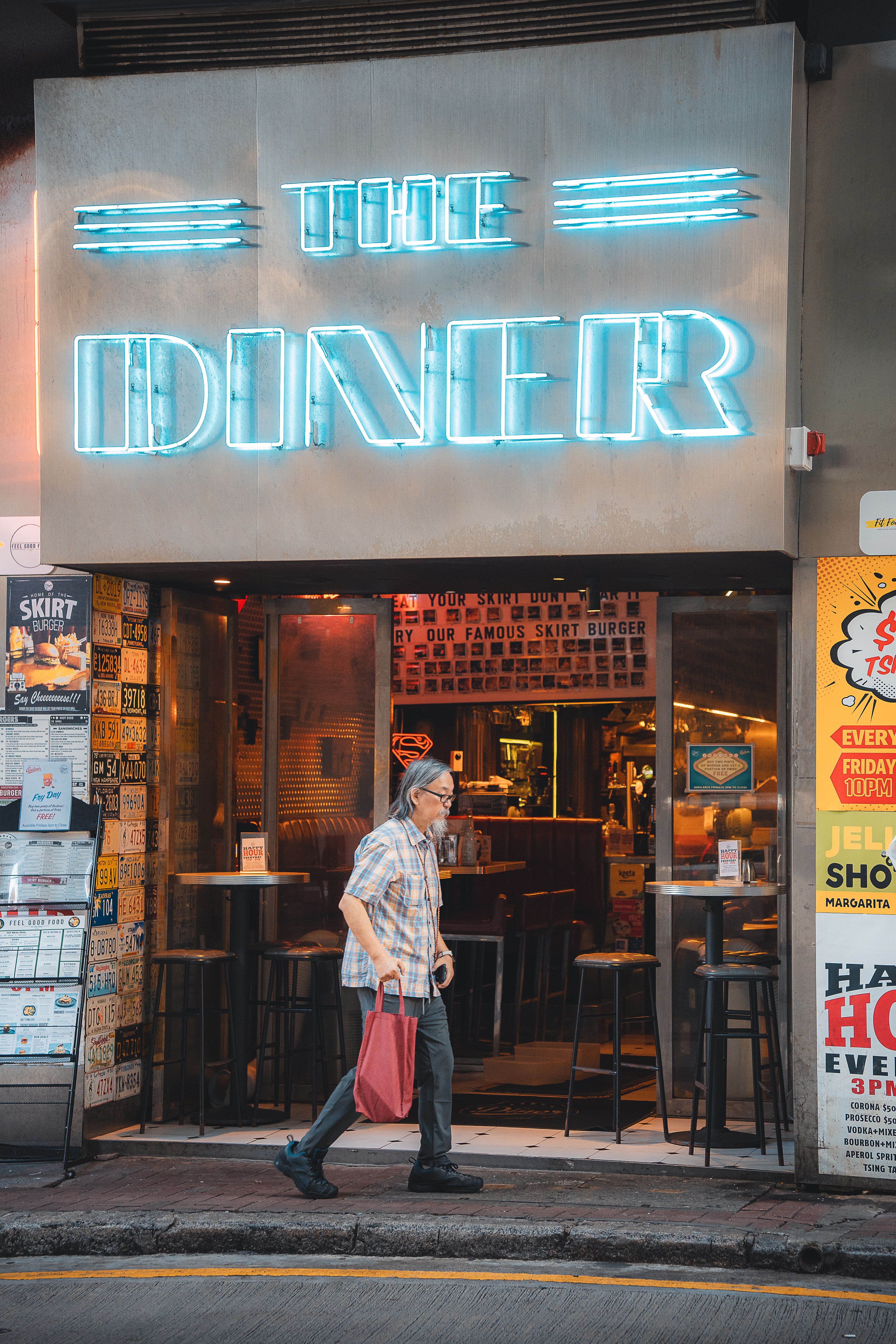 Evening Scene Outside a Neon Lit Diner in Hong Kong · Free Stock Photo
