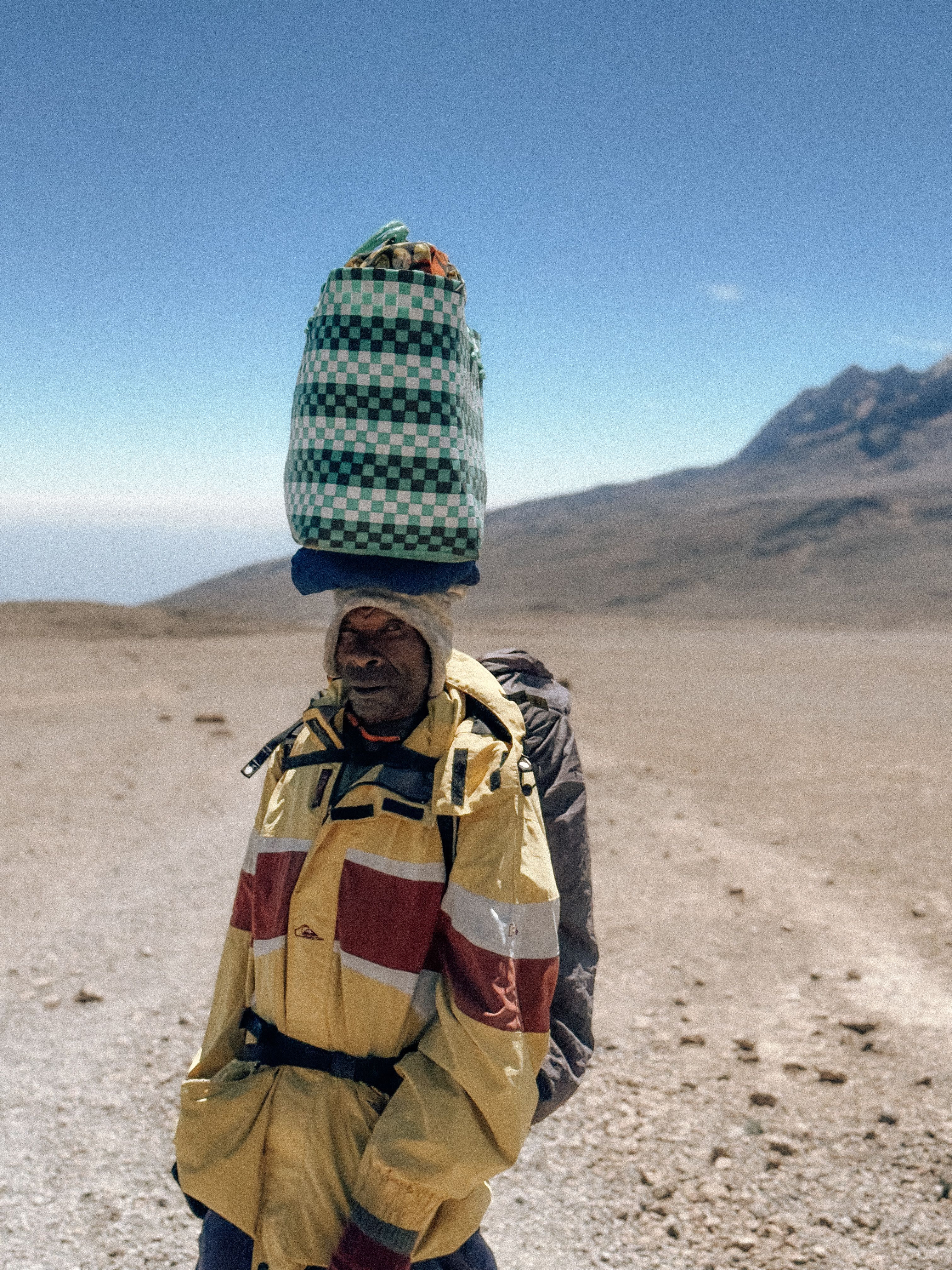 Porter Carrying Supplies on Mount Kilimanjaro · Free Stock Photo