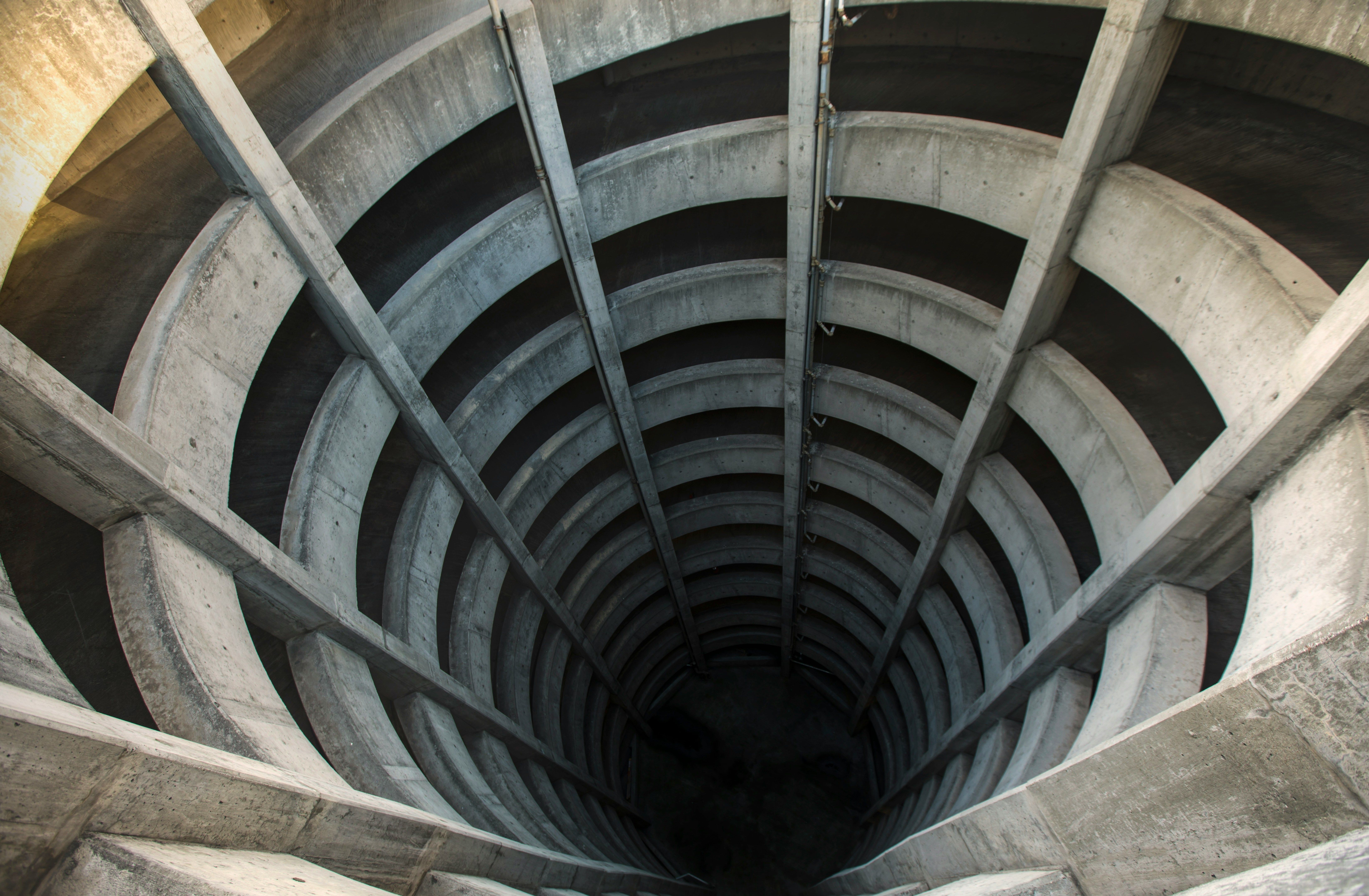 Circular Concrete Structure Viewed From Above · Free Stock Photo