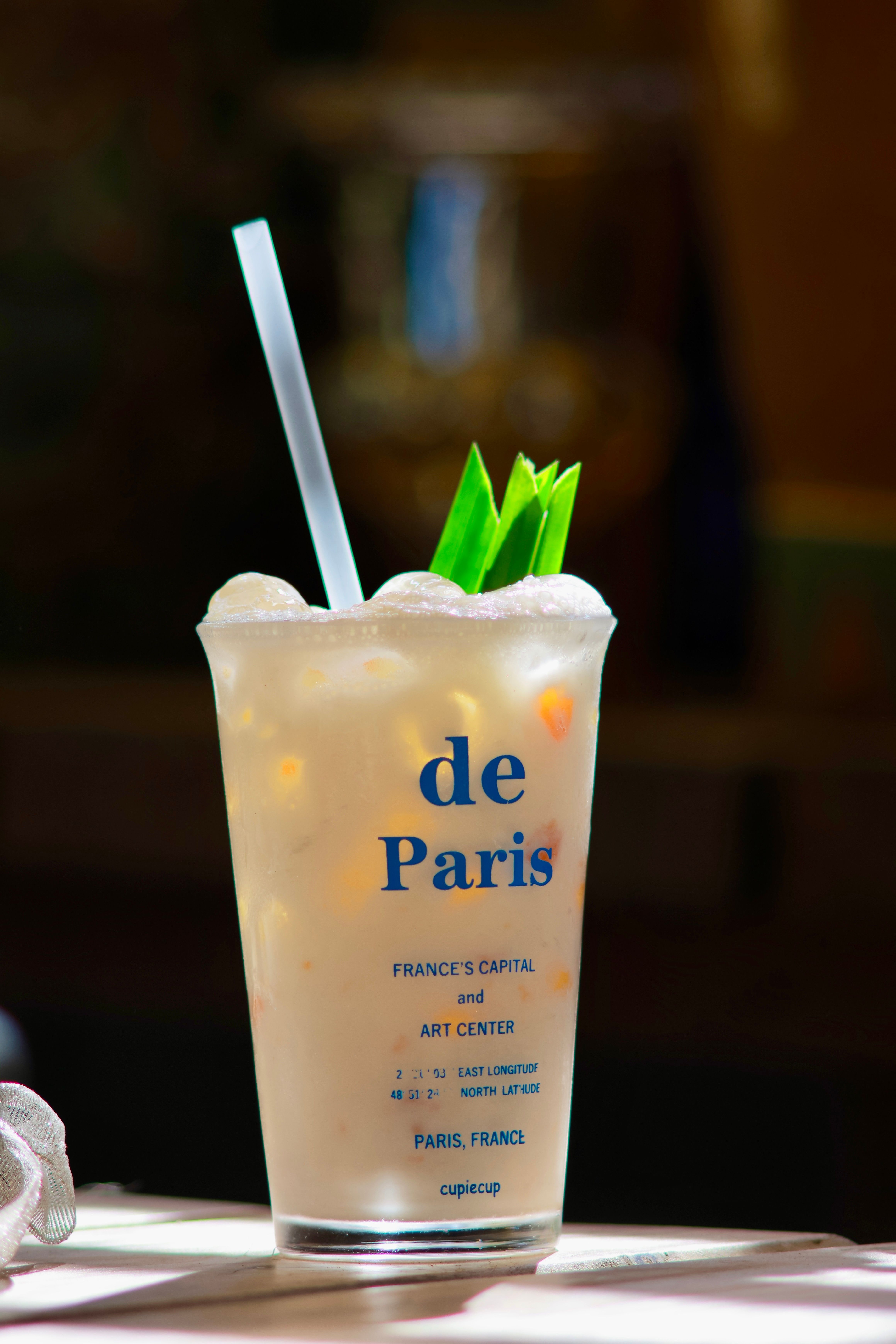 Chilled Beverage in Paris-Themed Cup · Free Stock Photo