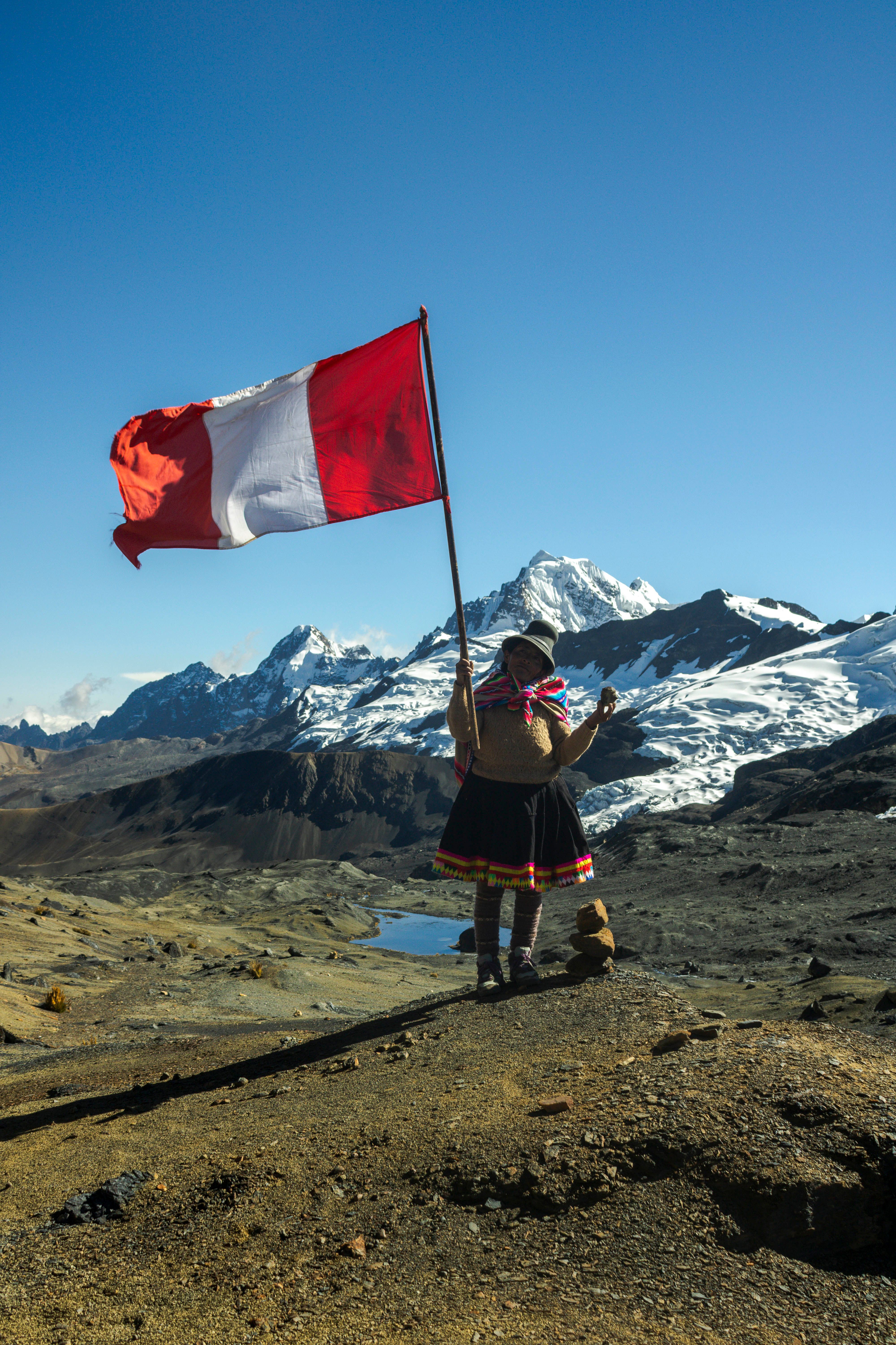 Peruvian Woman with Flag on Andes Mountains · Free Stock Photo