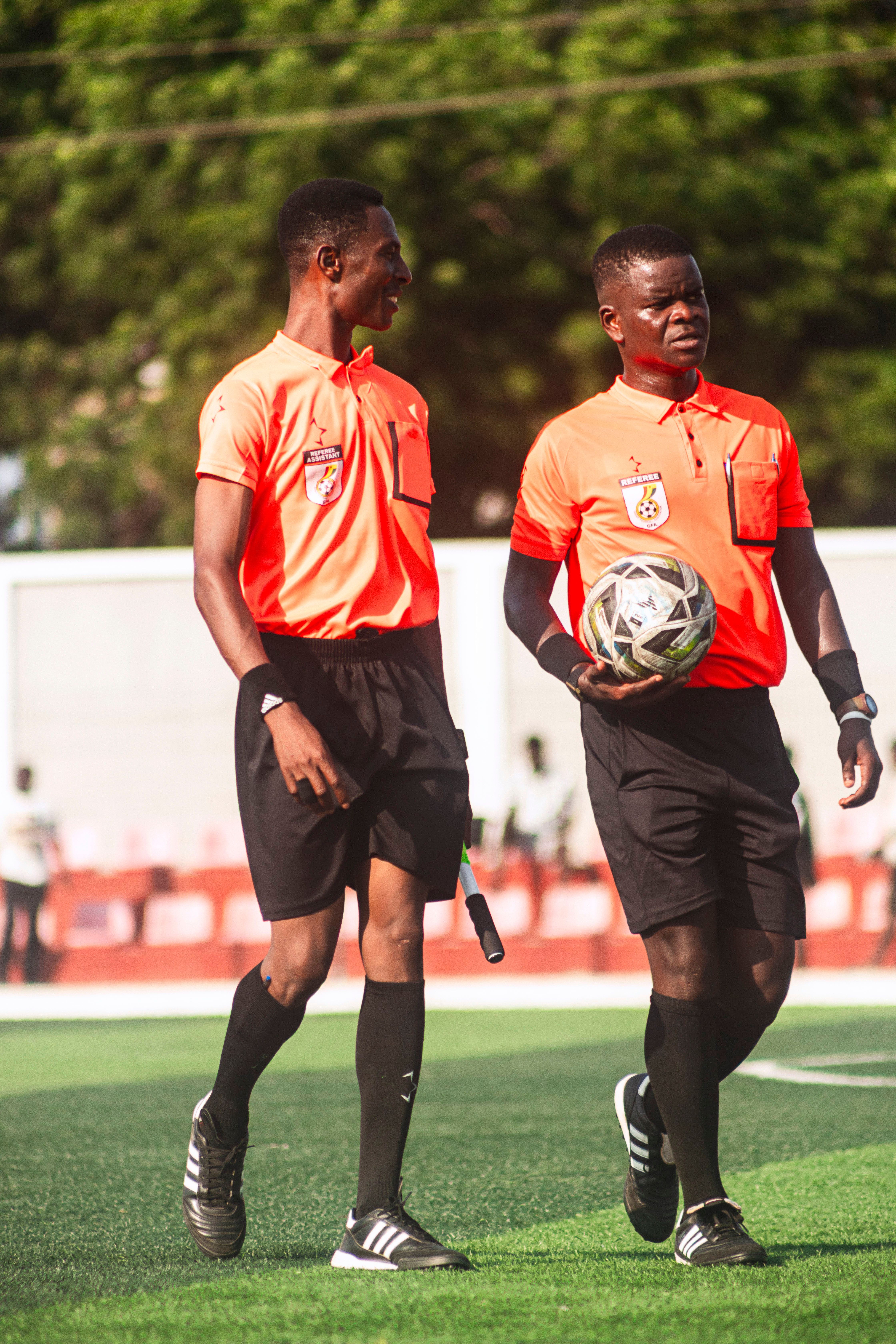 Soccer Referees on Football Field in Daylight · Free Stock Photo