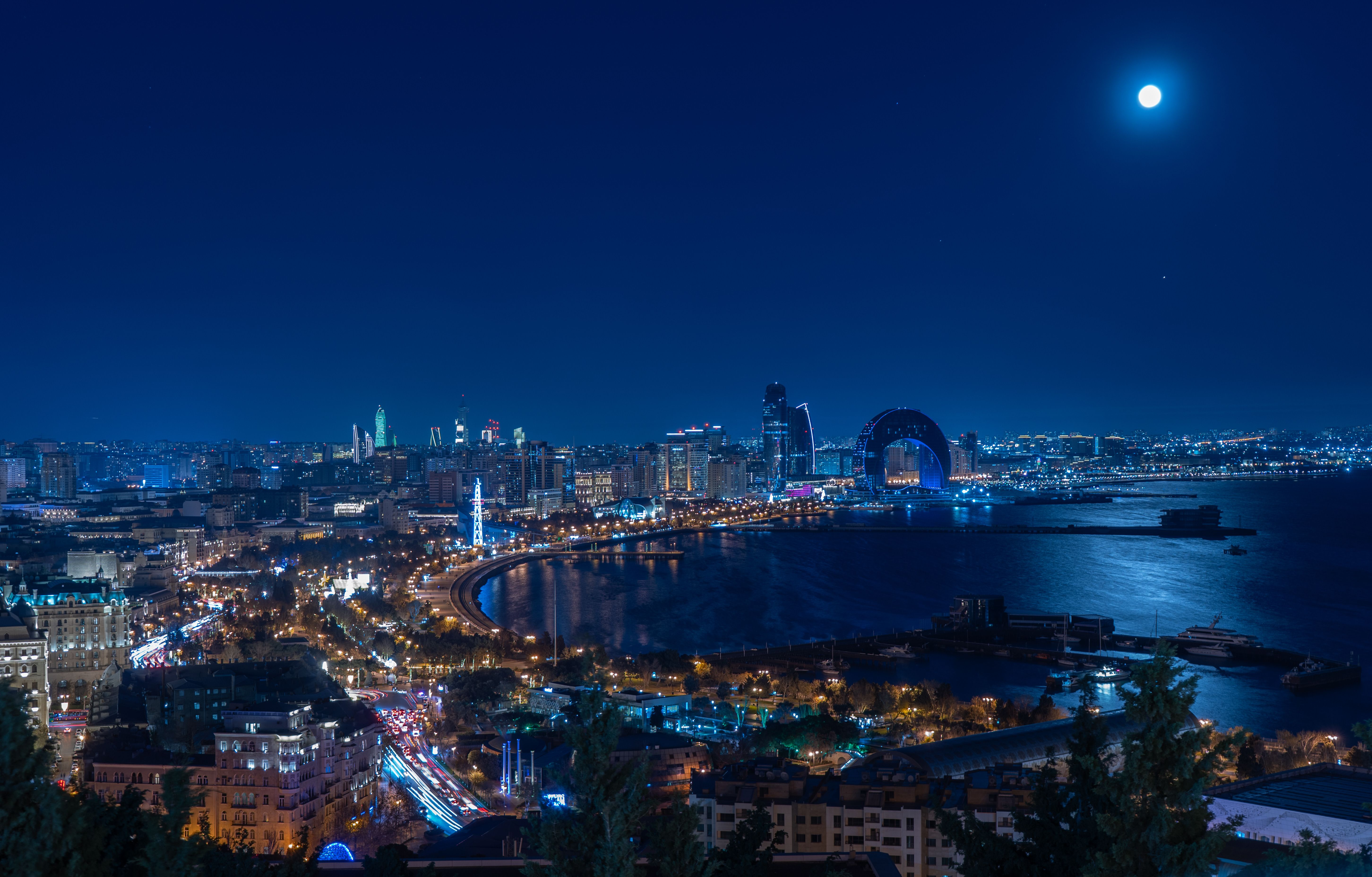 Stunning Night View of Baku Skyline with Full Moon · Free Stock Photo