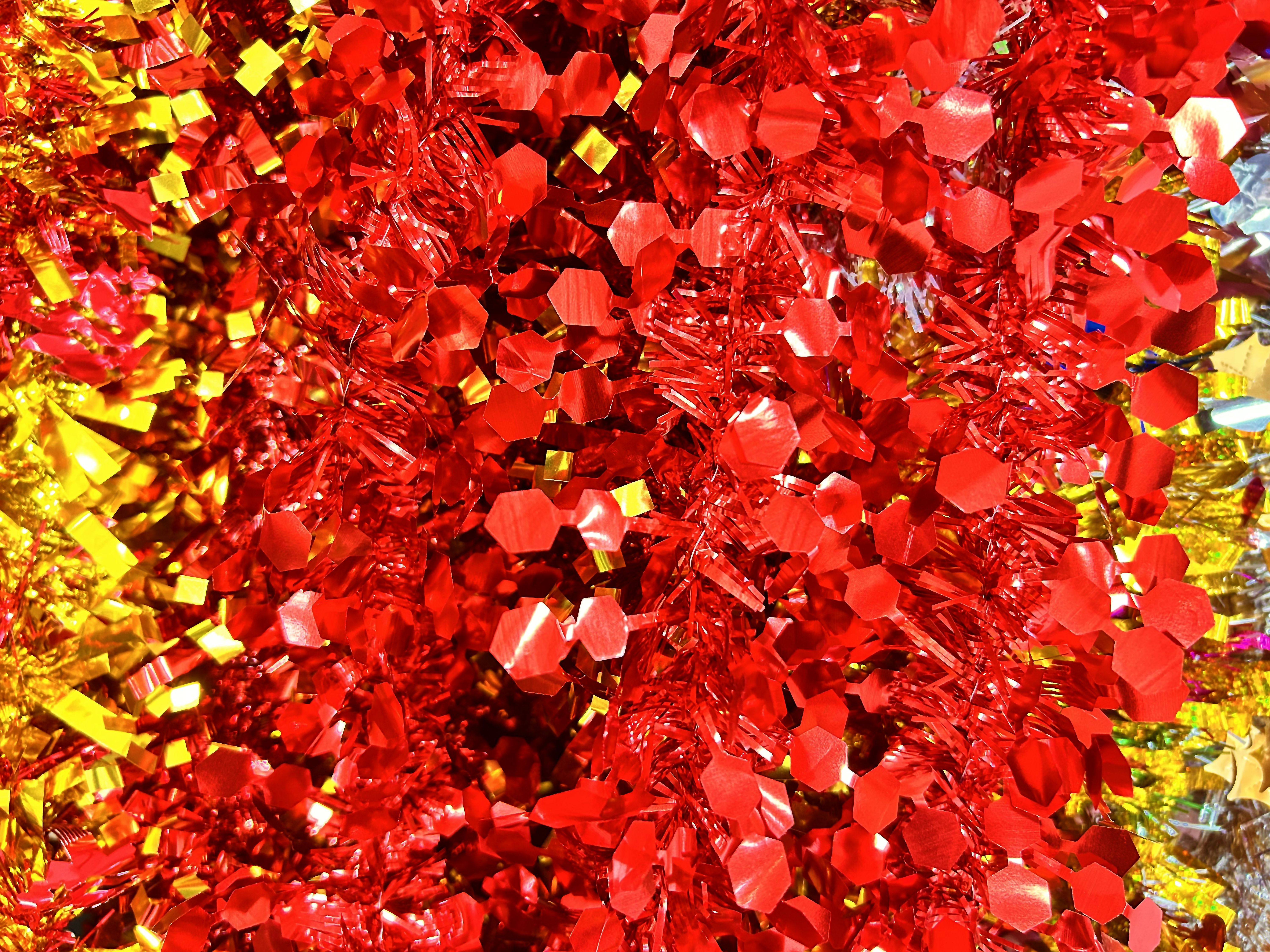 Vibrant Red and Gold Tinsel Decorations Close-Up · Free Stock Photo