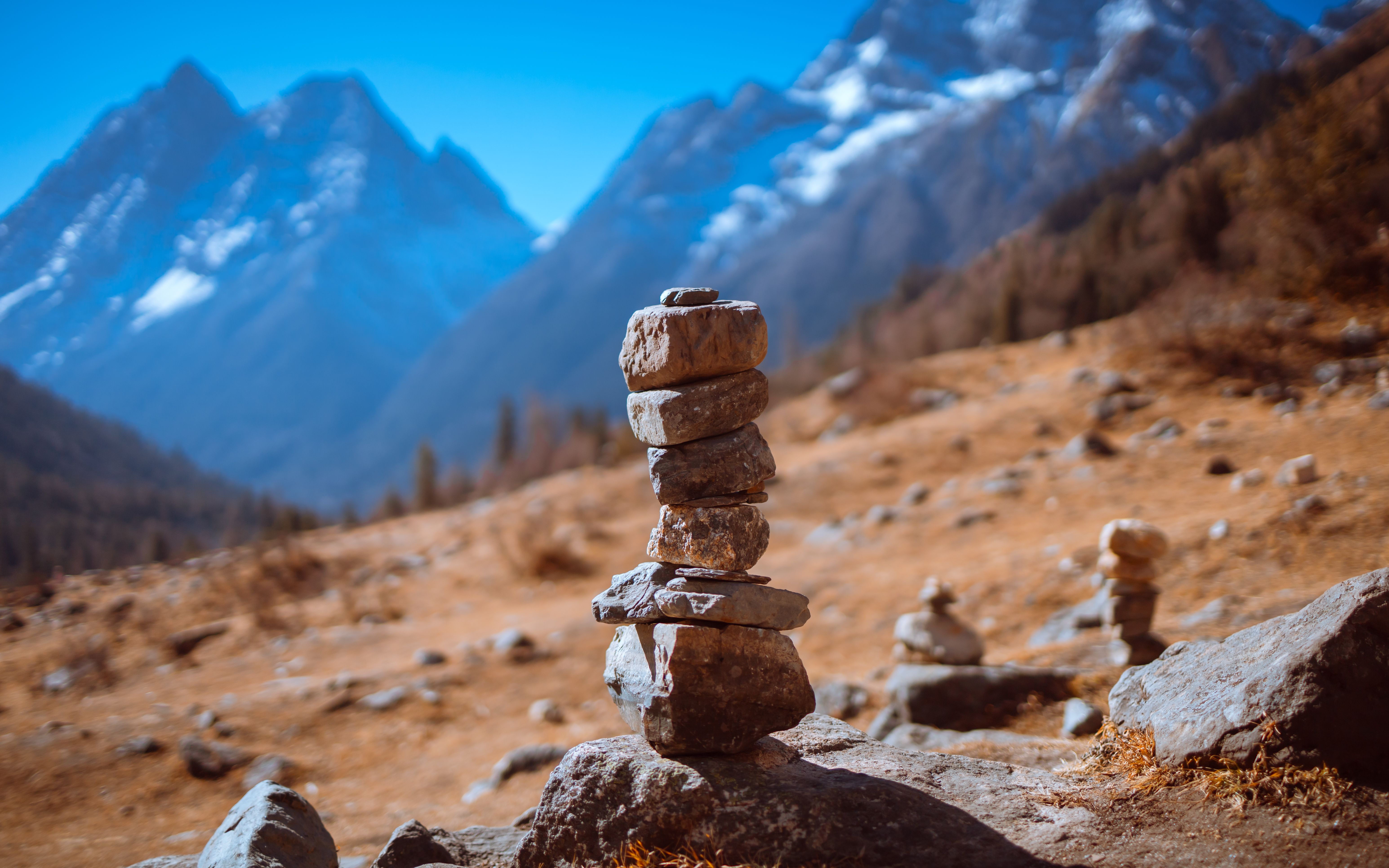 Stacked Stones in Scenic Mountain Landscape · Free Stock Photo