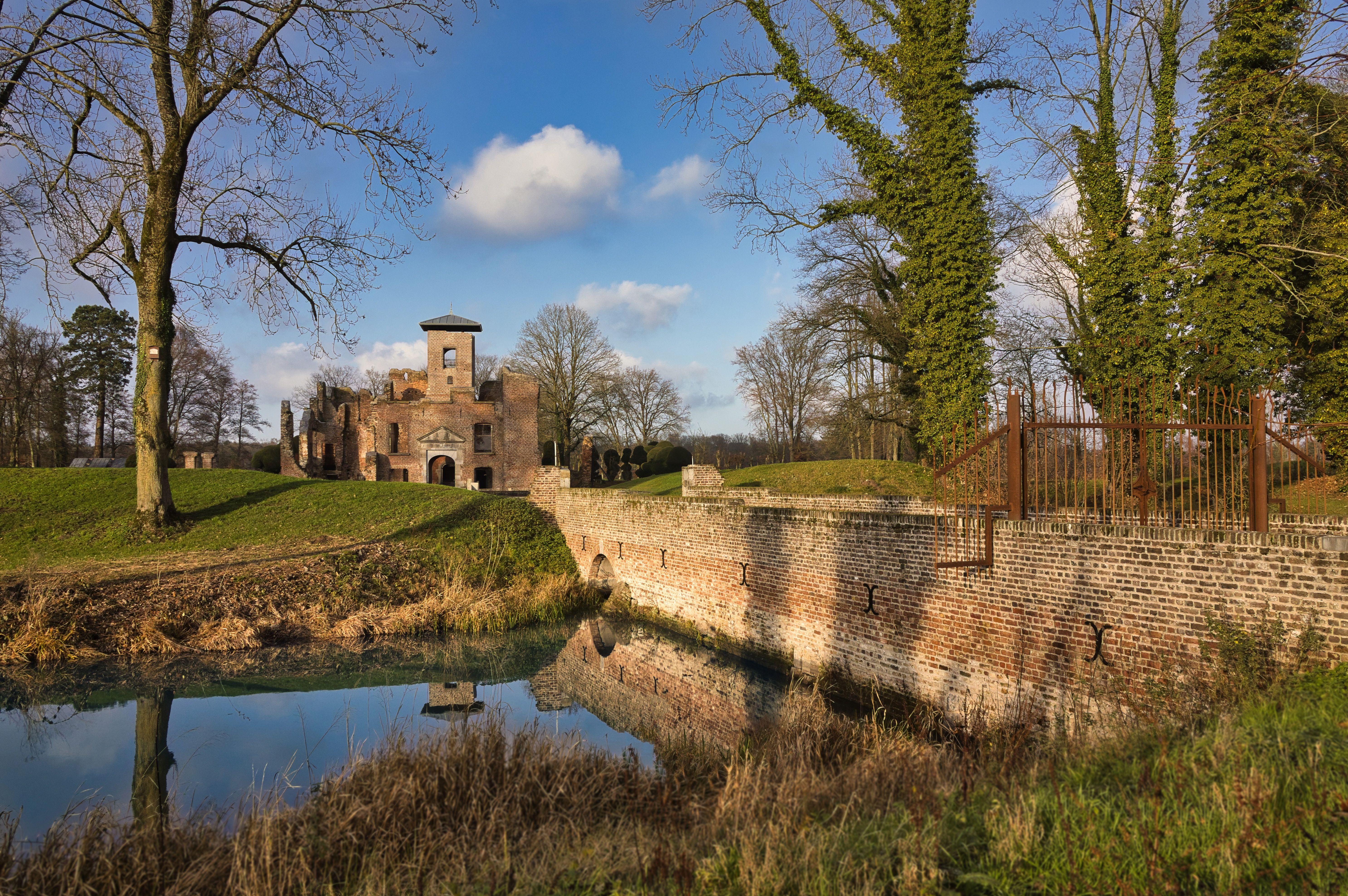Historic Brick Castle with Reflective Moat · Free Stock Photo