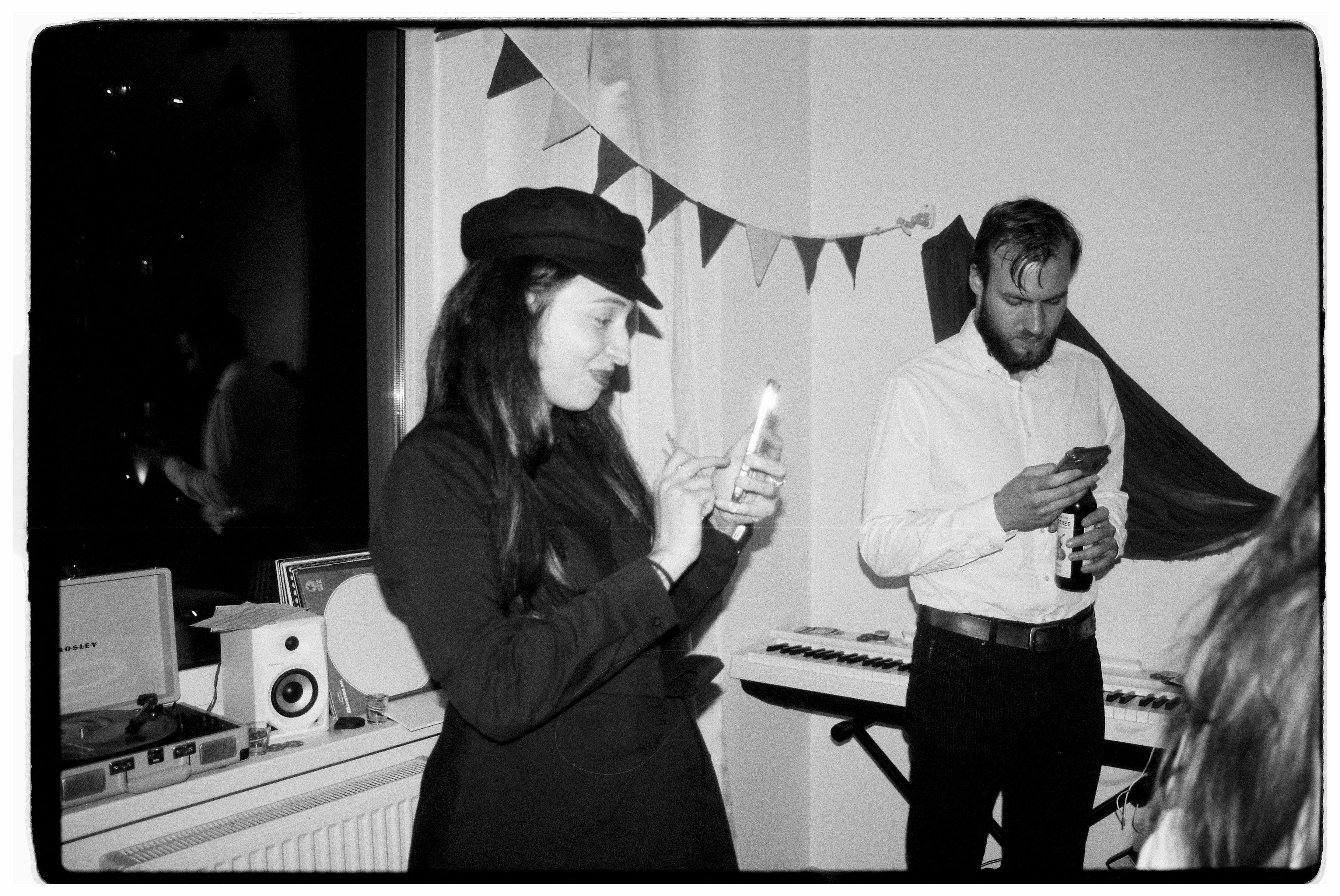 Black and White Party Scene with Phones · Free Stock Photo
