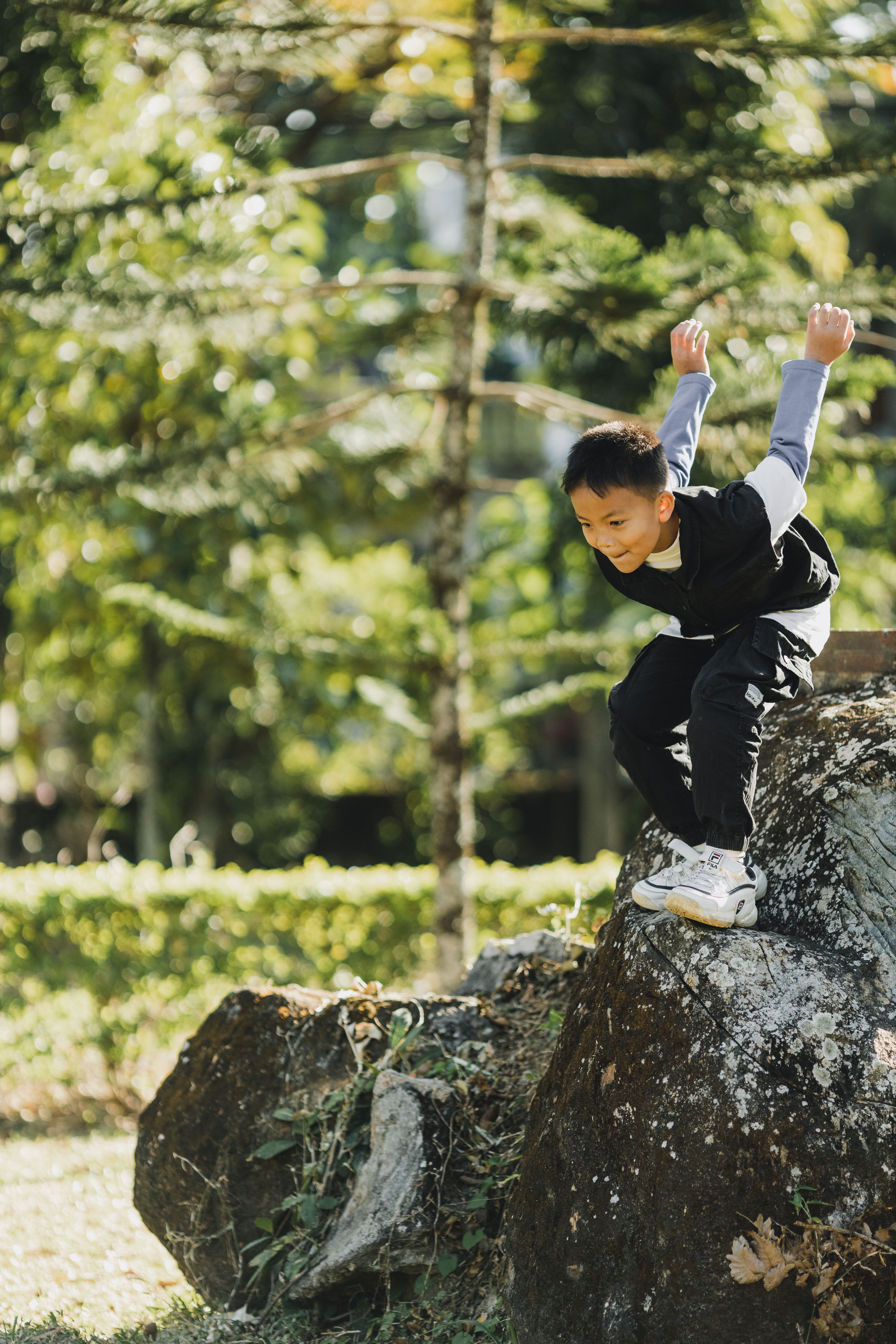 Boy Jumping Off Rock in Forest, Kon Tum · Free Stock Photo