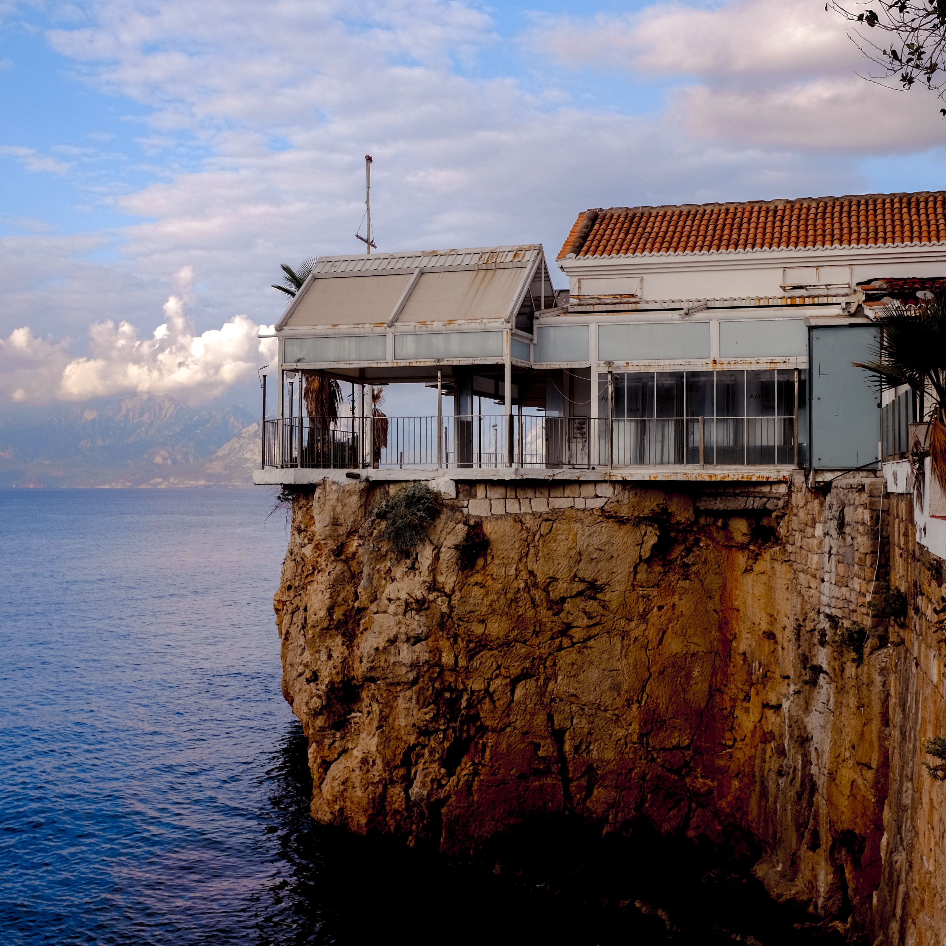 Seaside Clifftop House Overlooking Ocean · Free Stock Photo