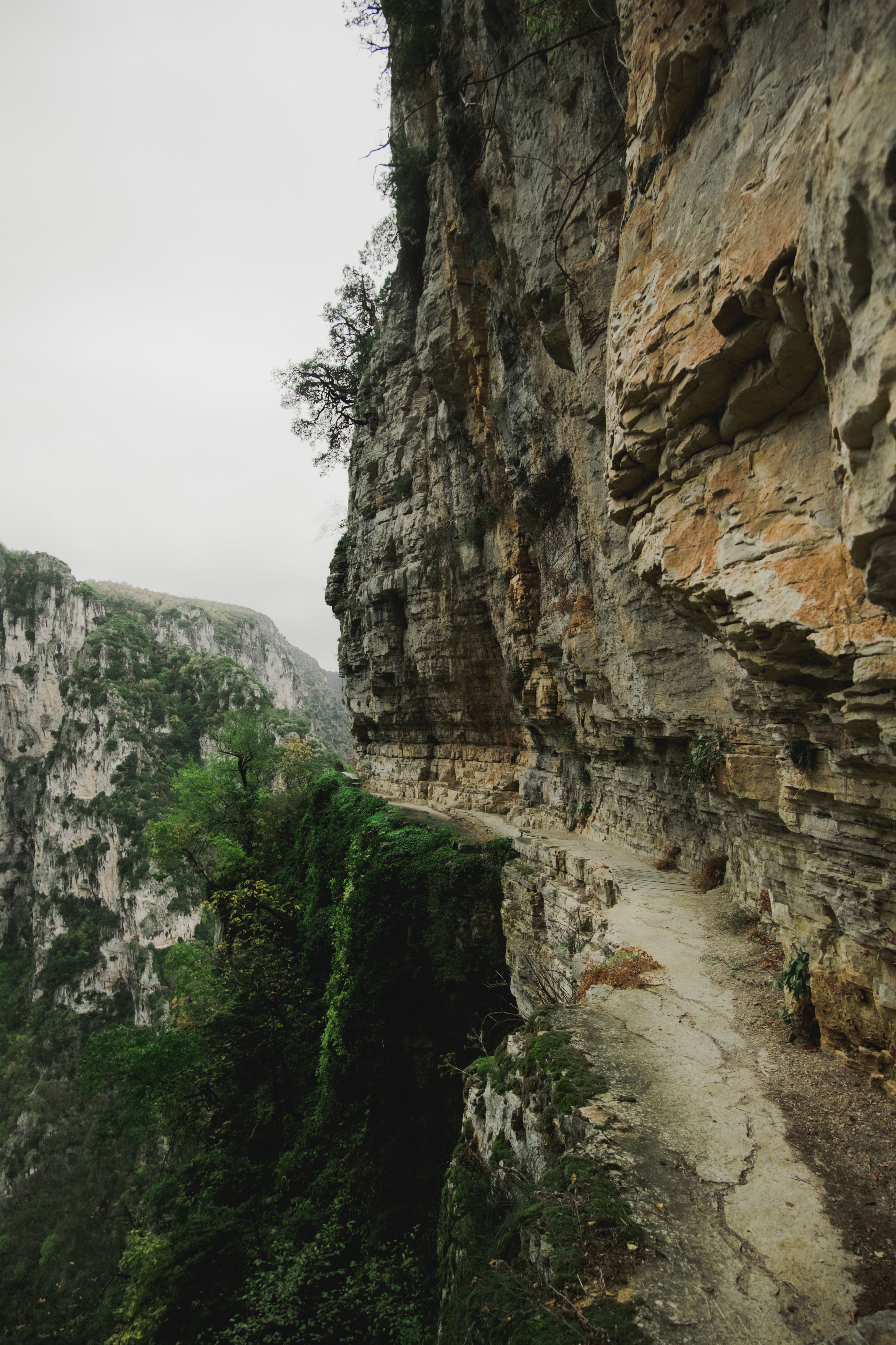 Narrow Mountain Path Along Steep Cliff Edge · Free Stock Photo