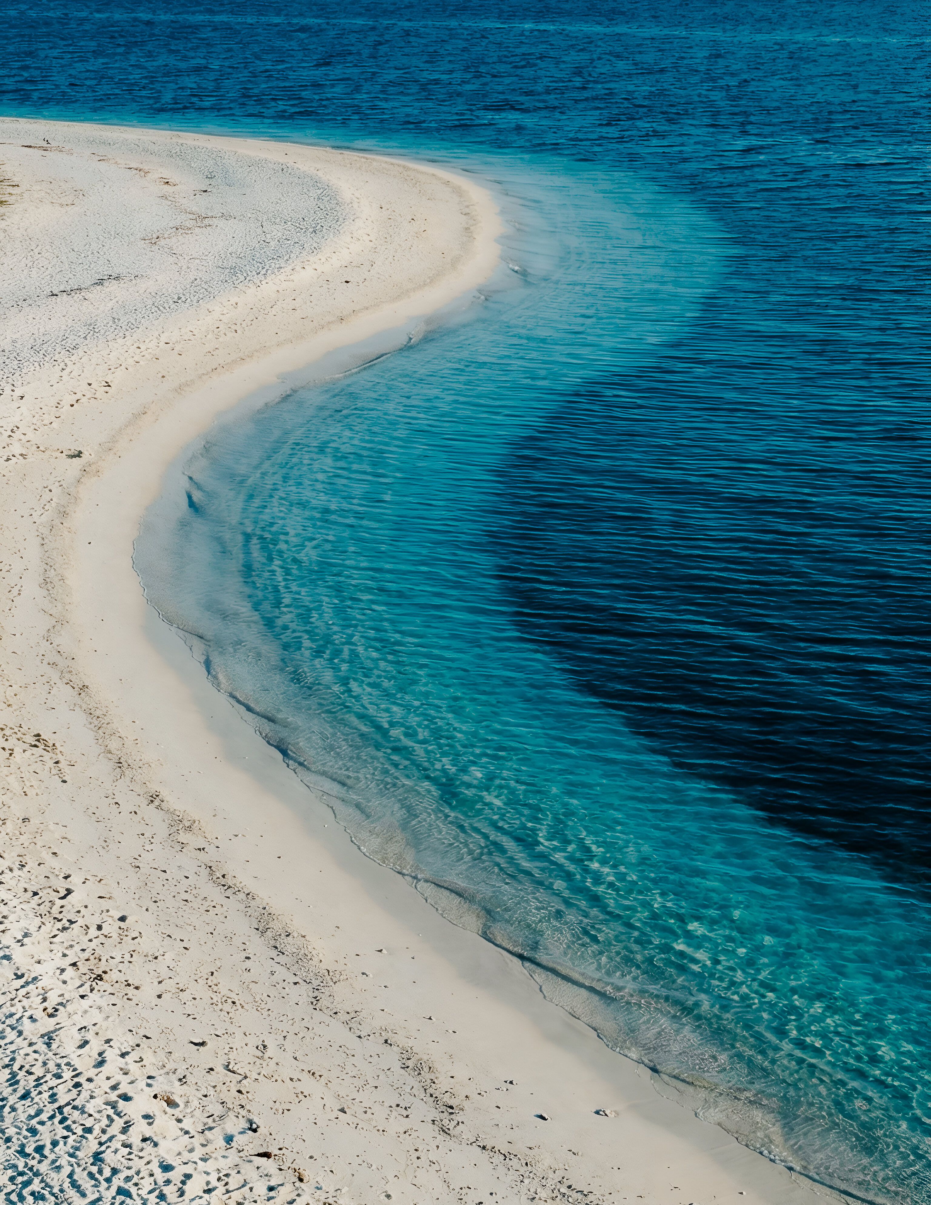 Serene Curved Beach with Clear Turquoise Waters · Free Stock Photo