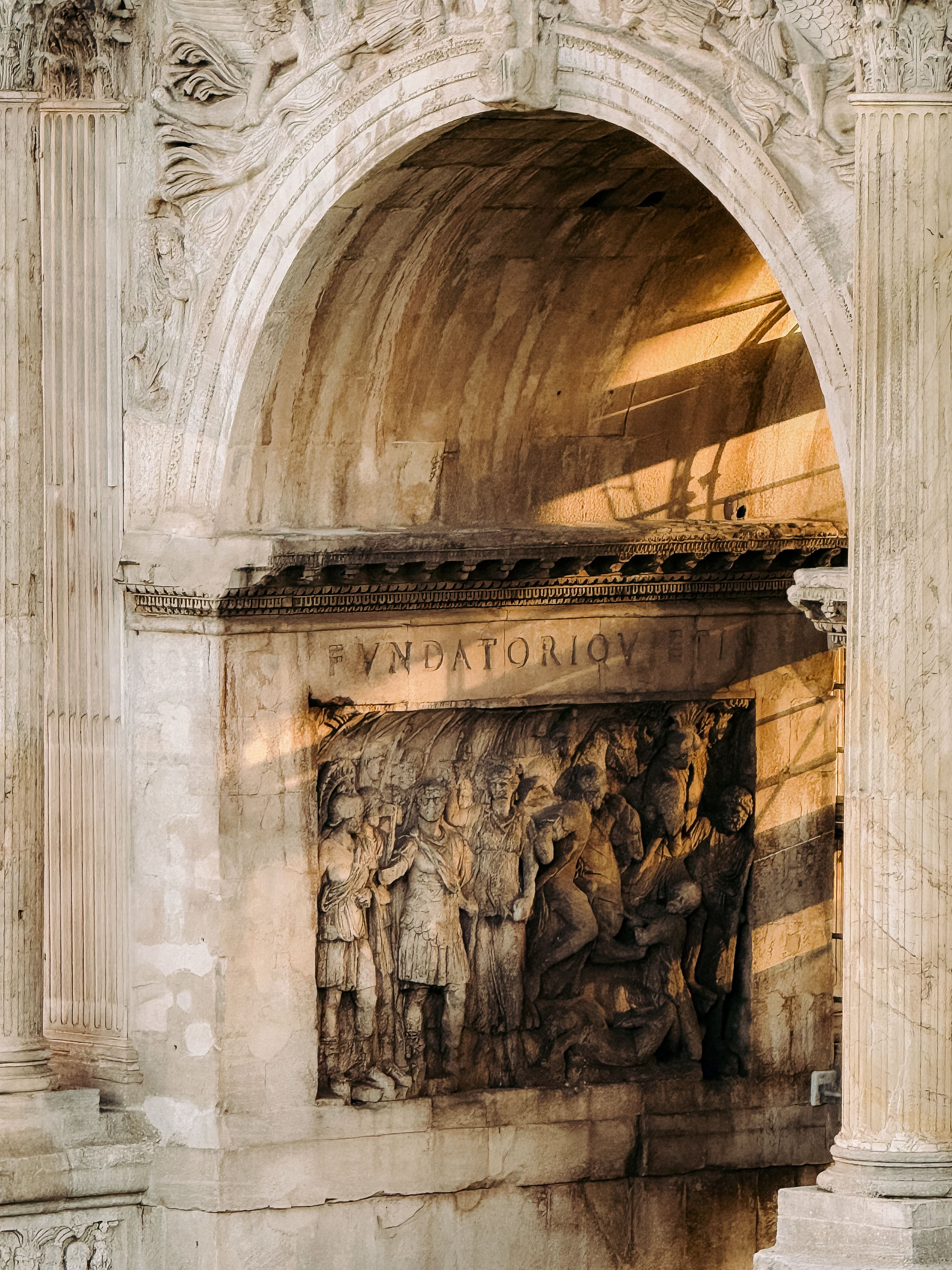 Historic Roman Arch with Intricate Stone Carvings · Free Stock Photo