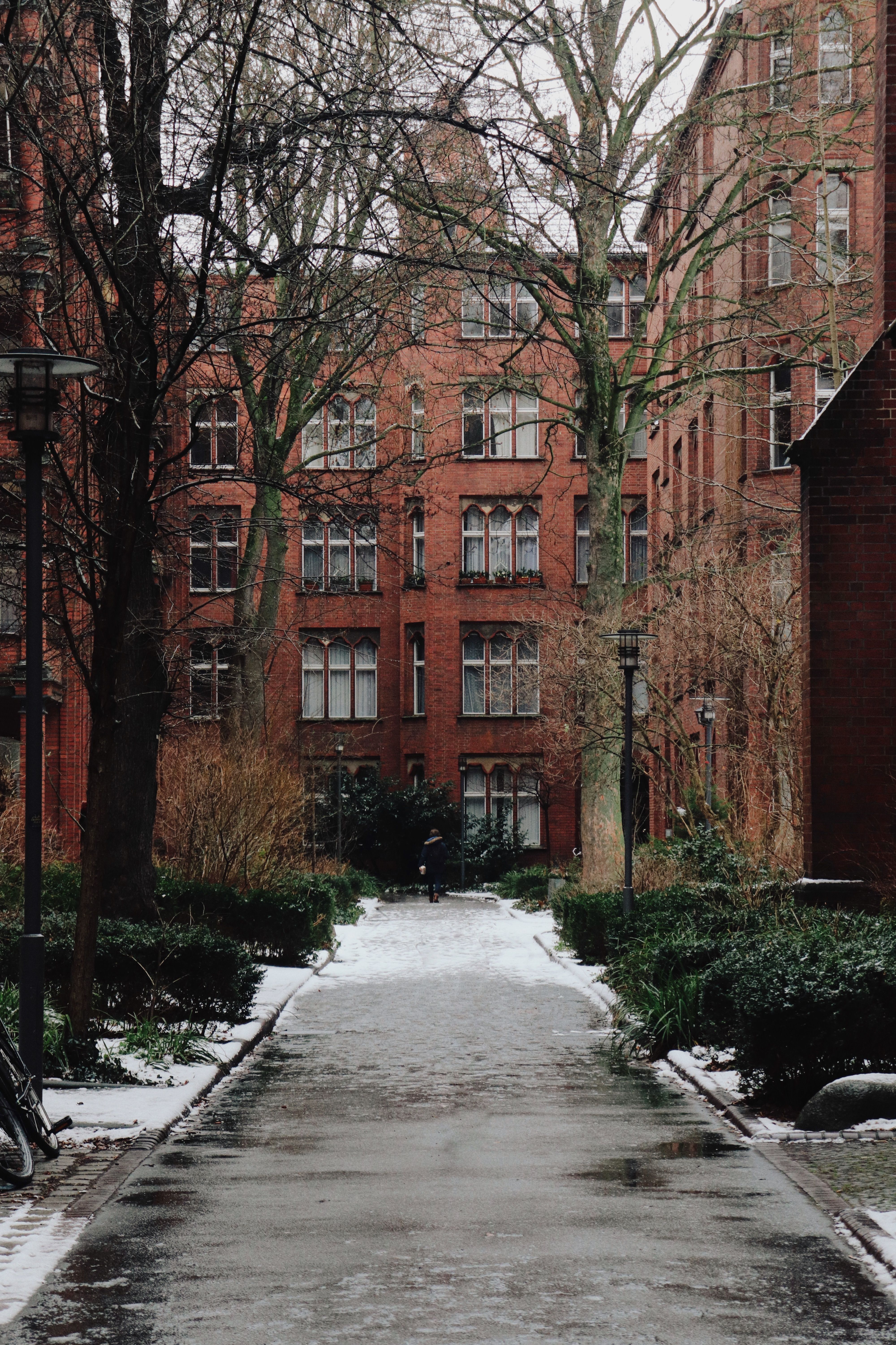 Snowy Path Leading to Red Brick Building · Free Stock Photo