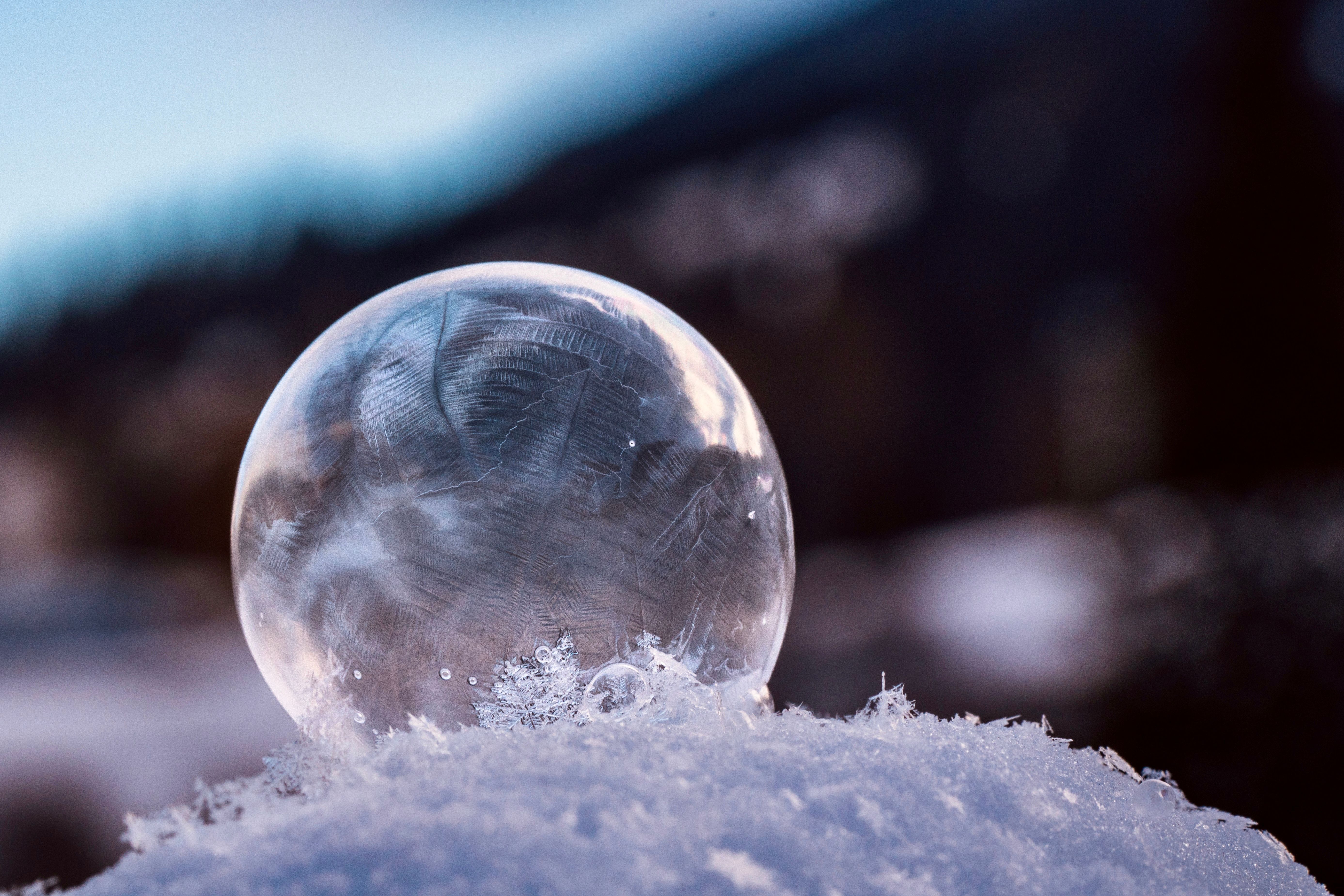 Frosty Bubble Resting on Snow in Winter · Free Stock Photo