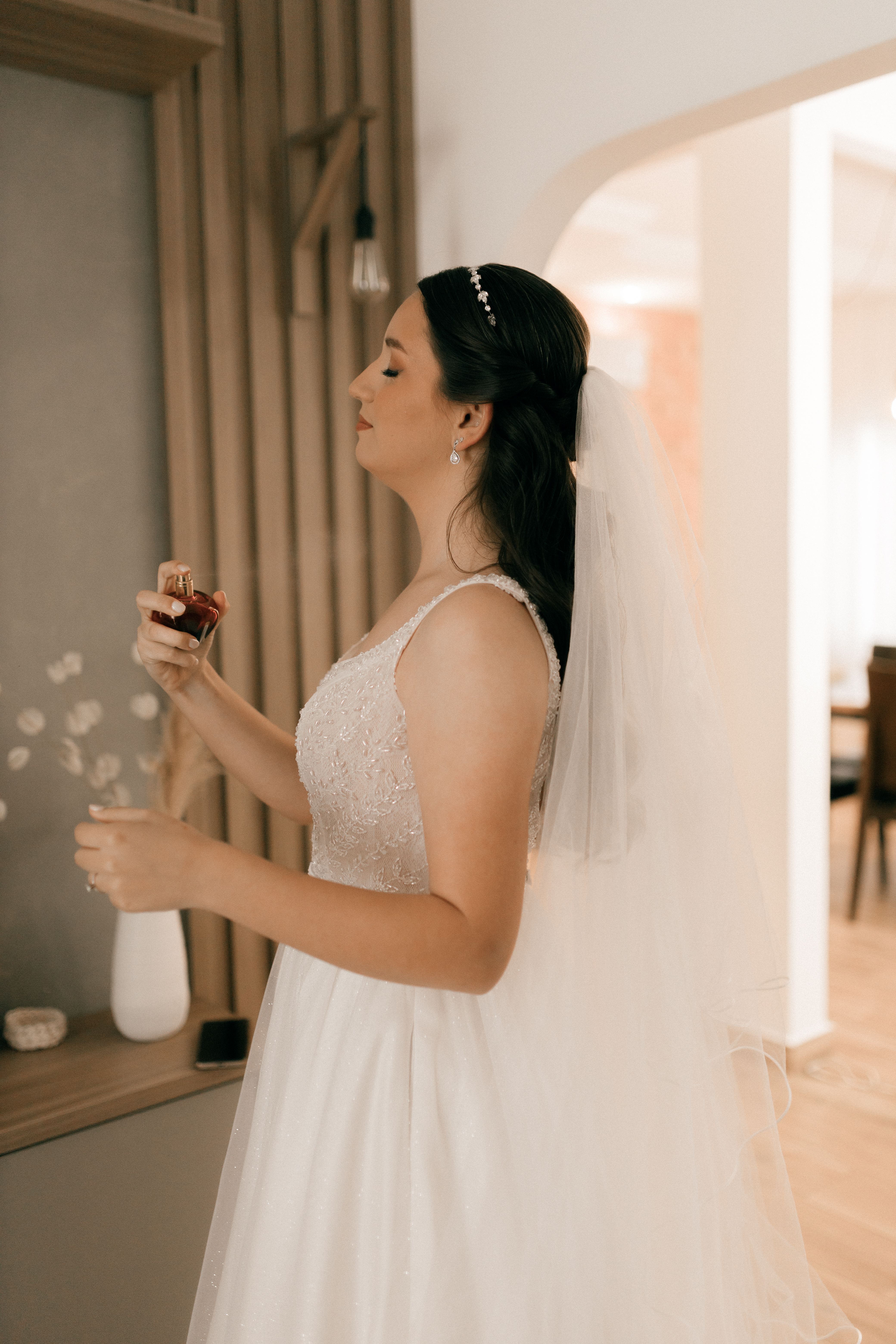 Elegant Bride Applying Perfume Before Ceremony · Free Stock Photo