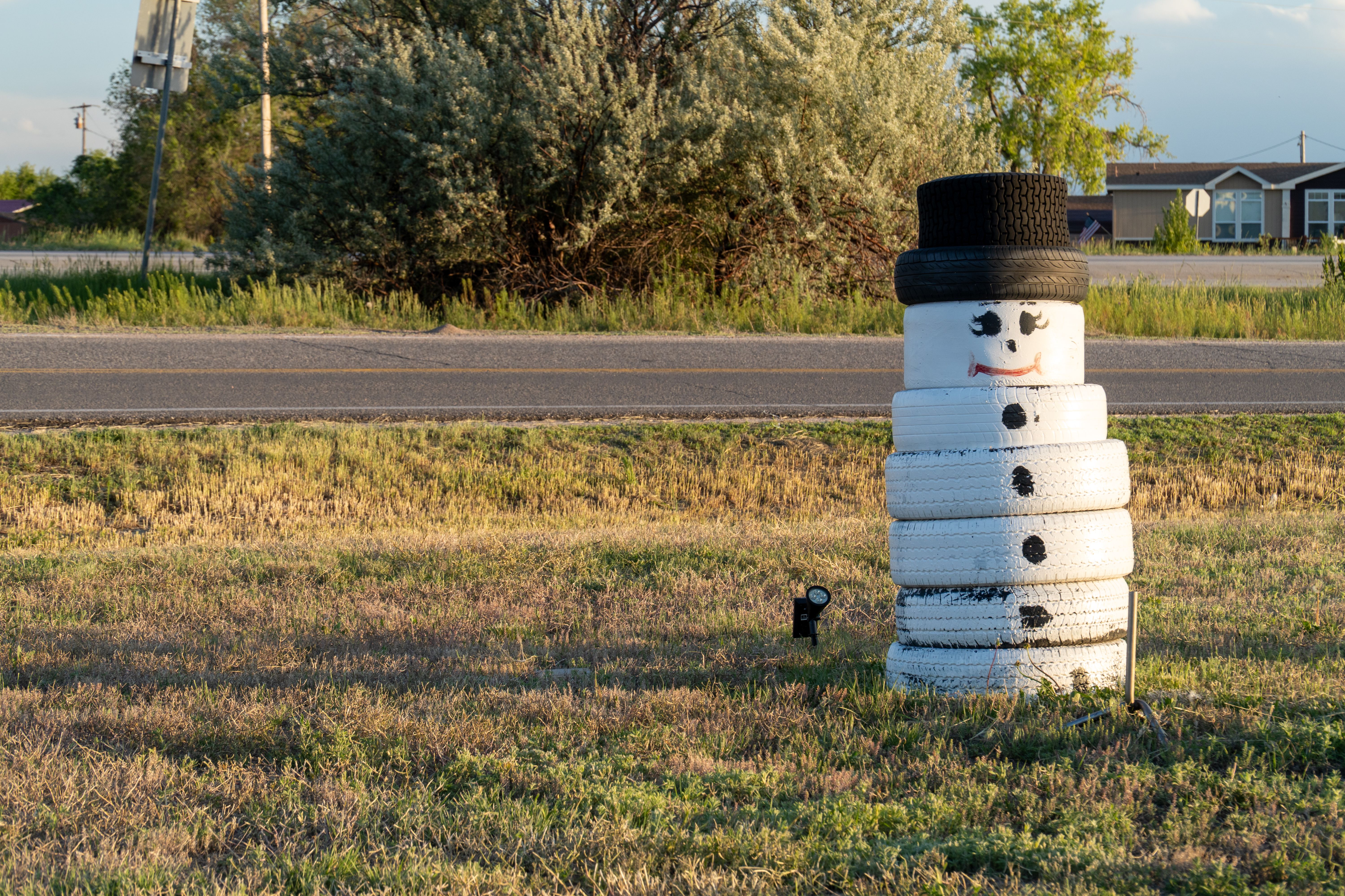 Creative Snowman Sculpture Made of Tires · Free Stock Photo