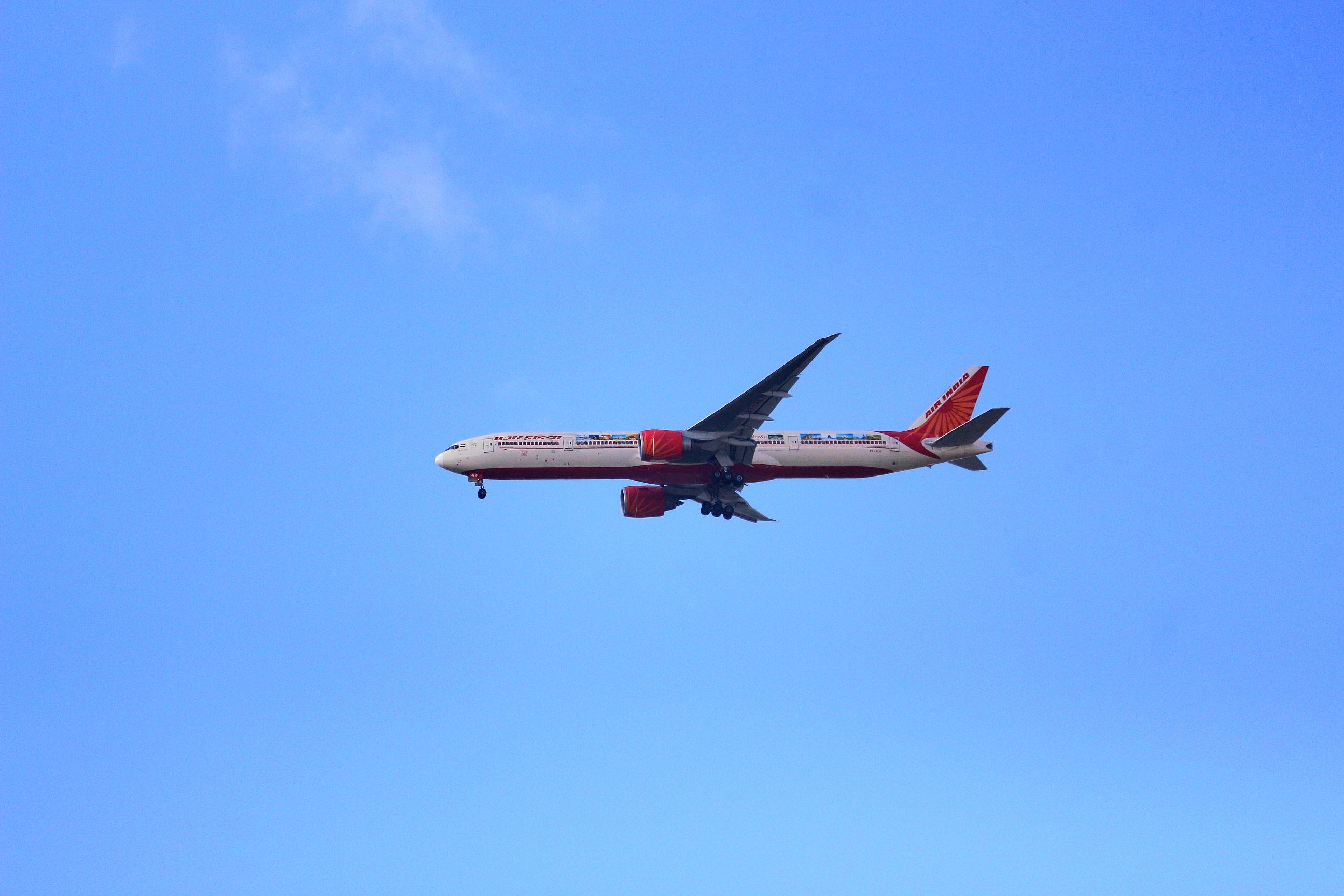 Commercial Jet Airliner in Flight Against Blue Sky · Free Stock Photo
