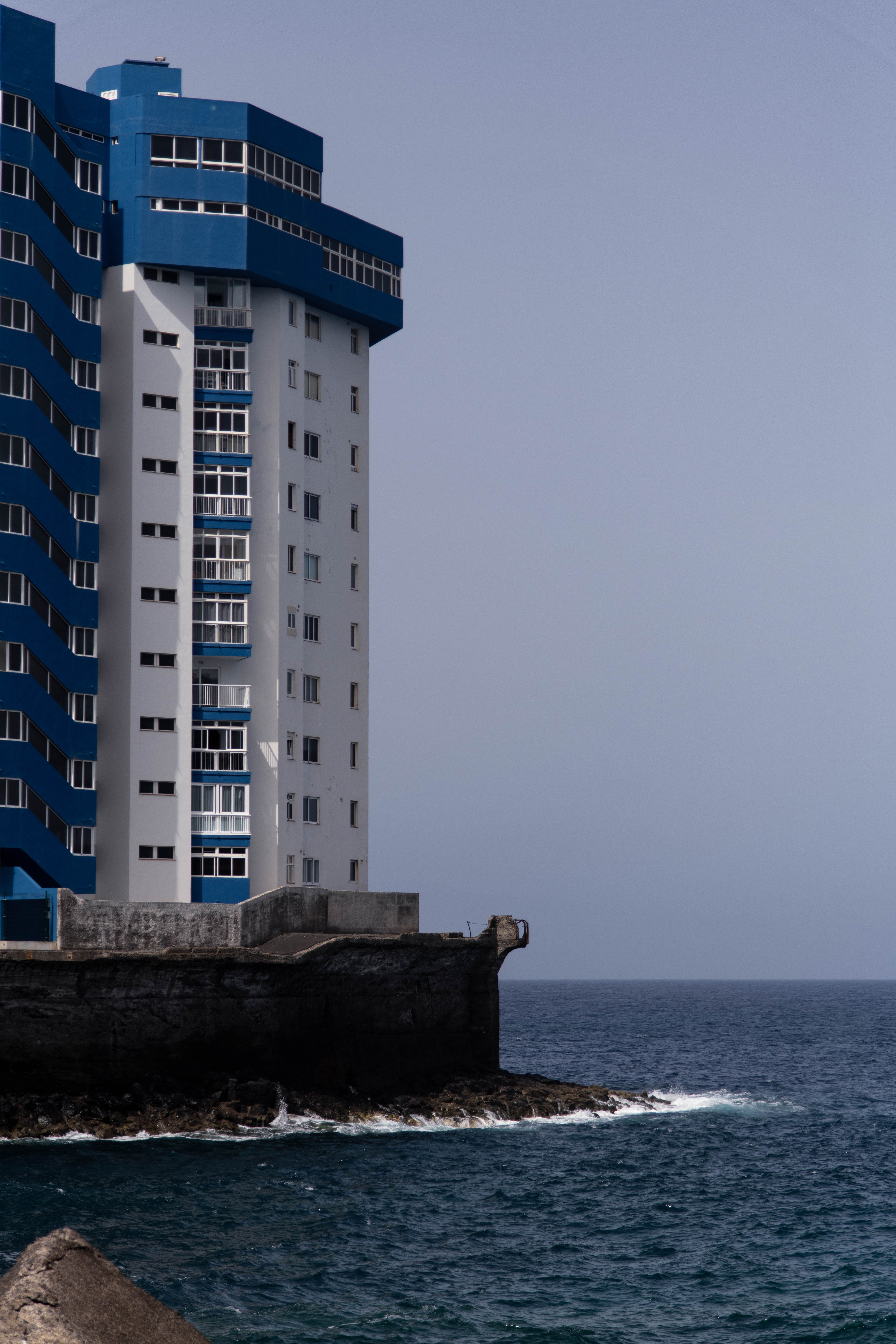Modern Seaside Building with Blue Facade · Free Stock Photo