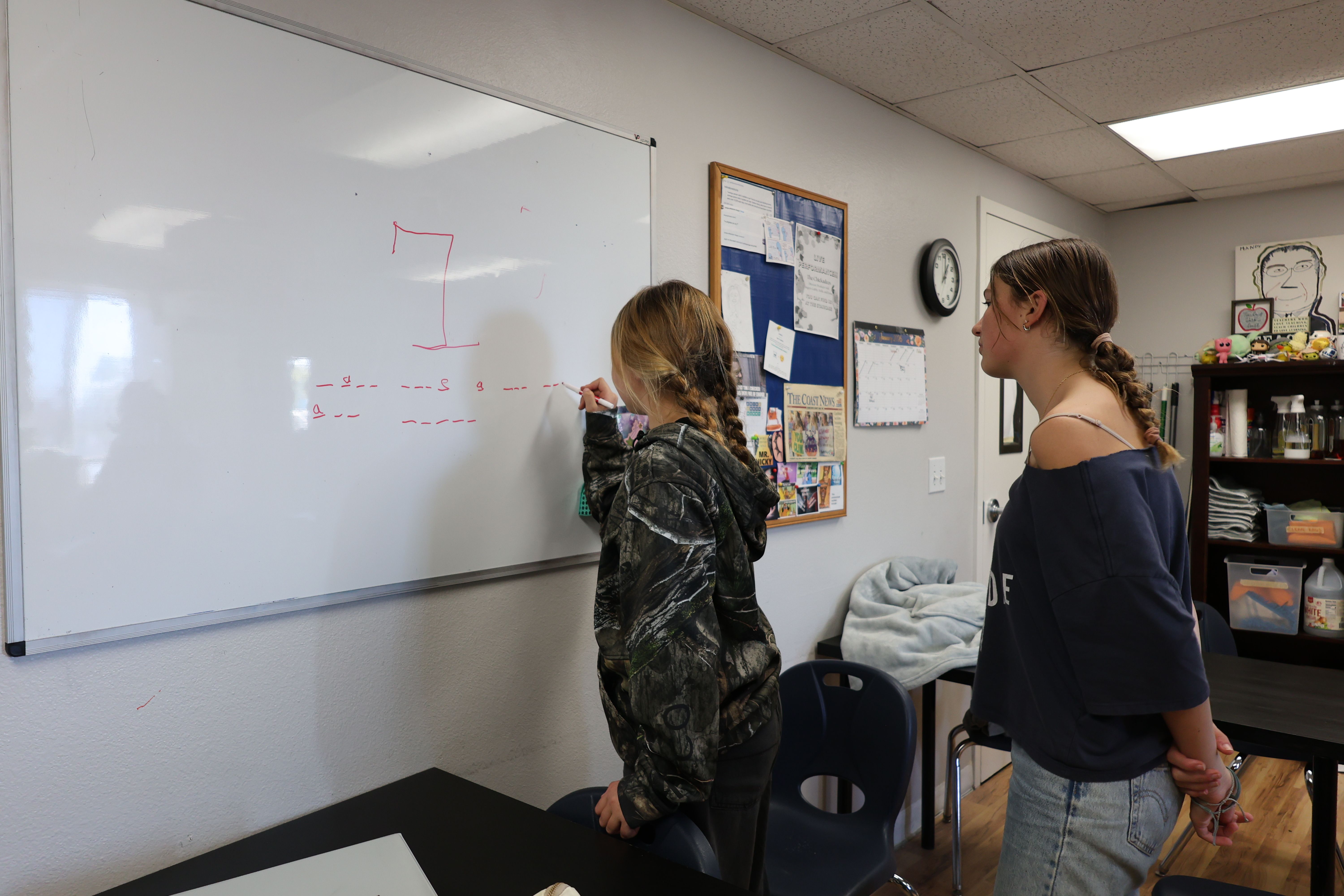 Two Young Women Collaborating on Classroom Activity · Free Stock Photo