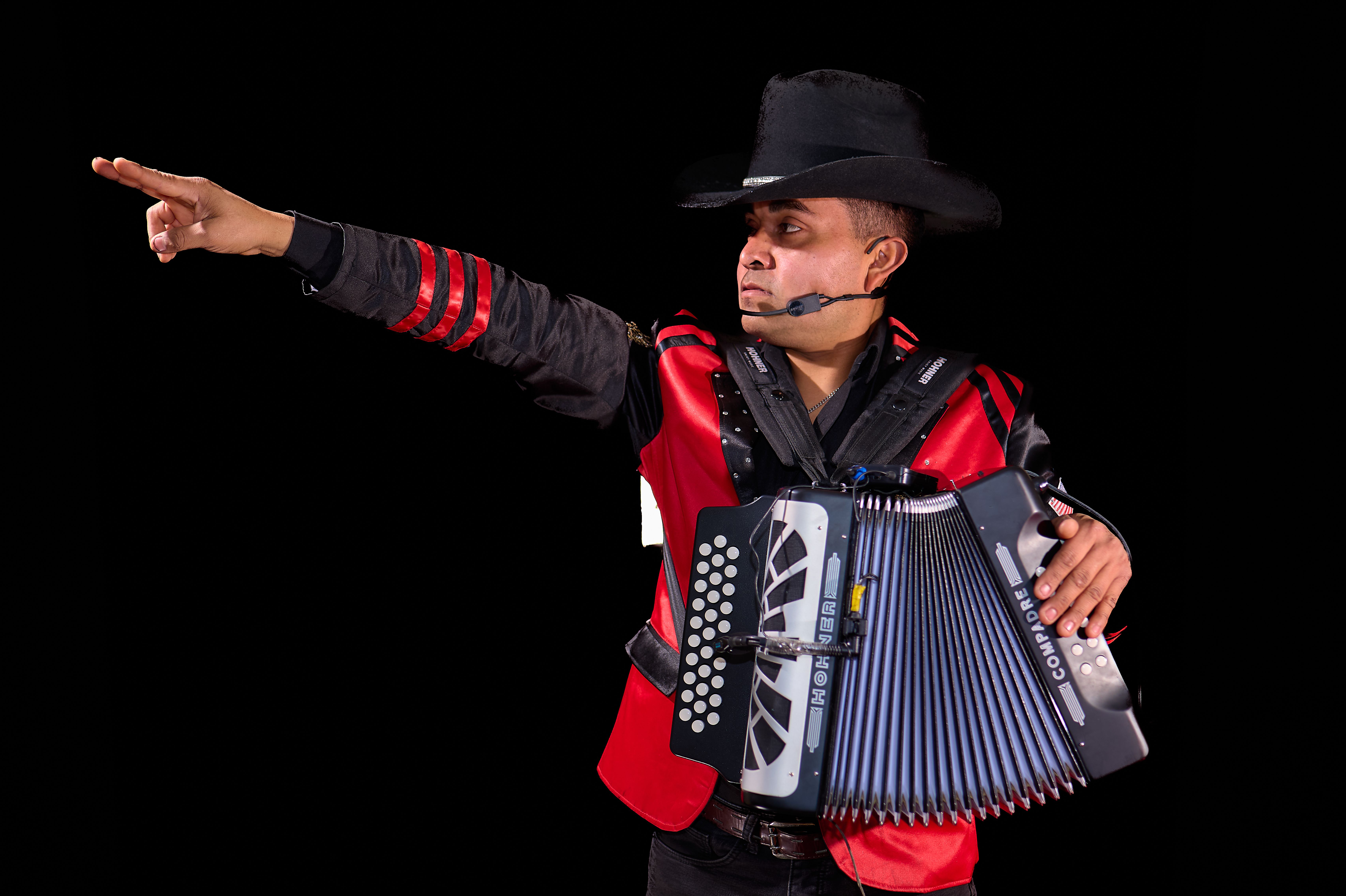 Dynamic Accordion Player in Black and Red Attire · Free Stock Photo