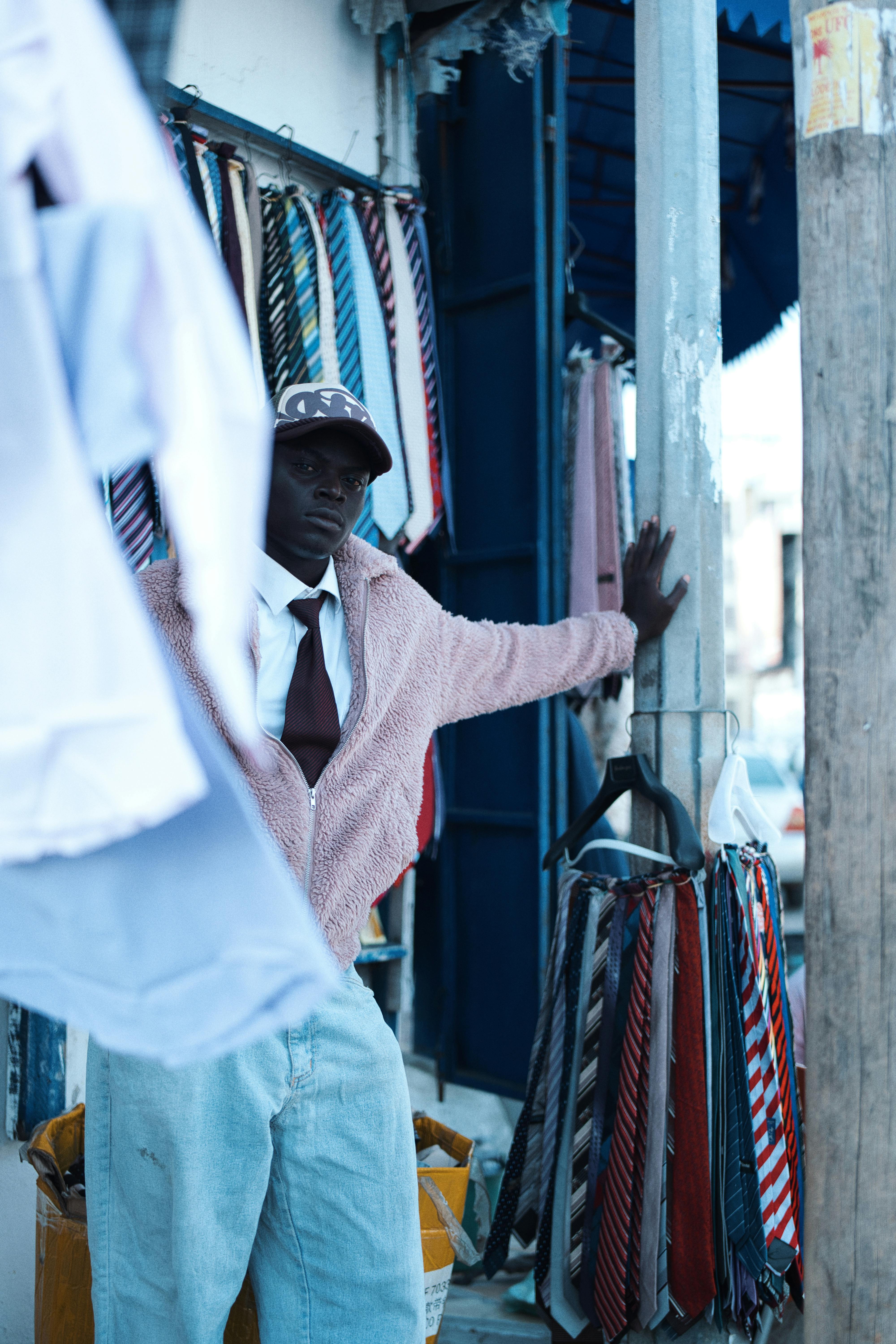 Street Vendor with Ties Display on City Sidewalk · Free Stock Photo
