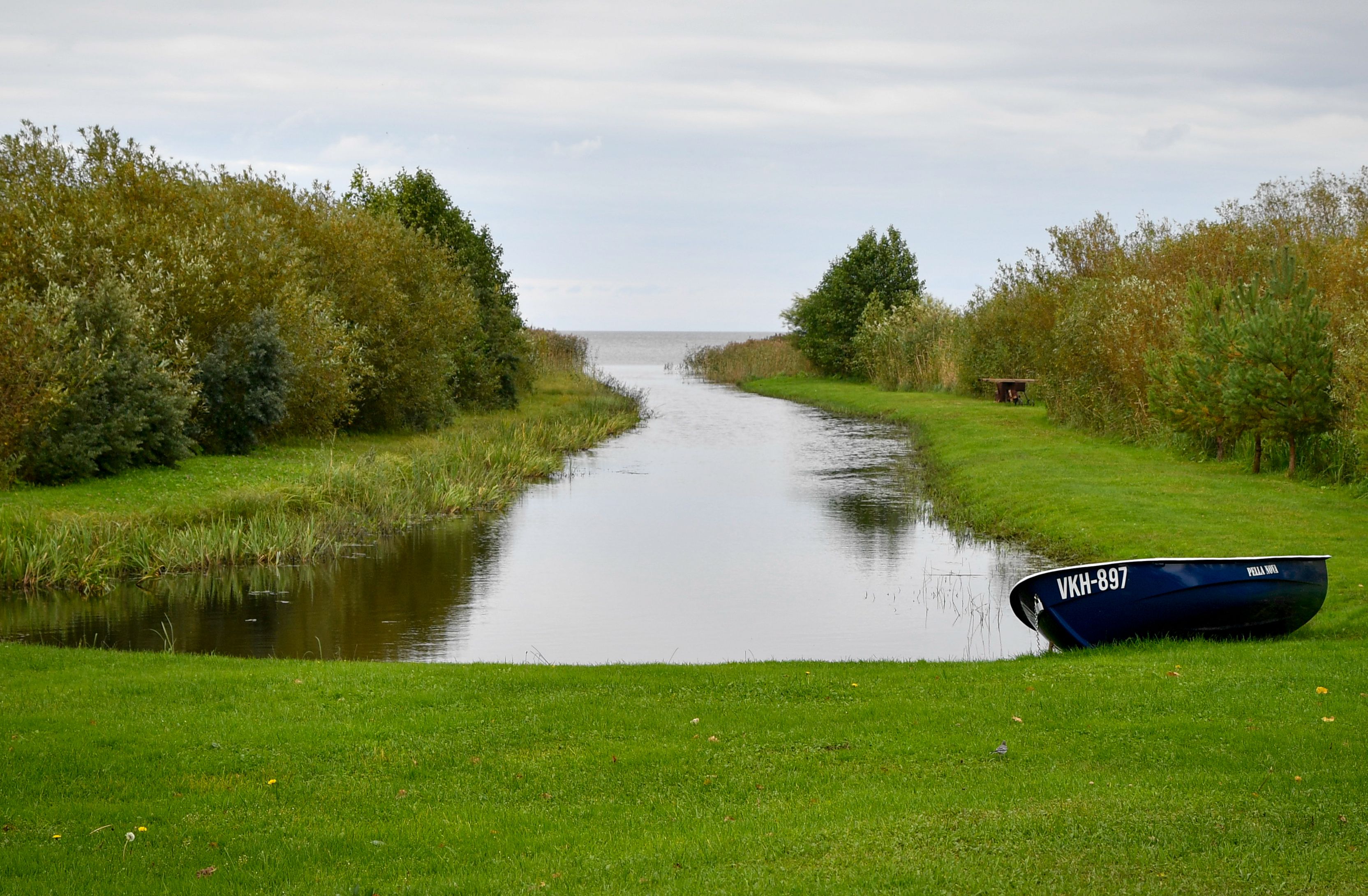 Serene Boat by Calm Canal in Tartu County, Estonia · Free Stock Photo