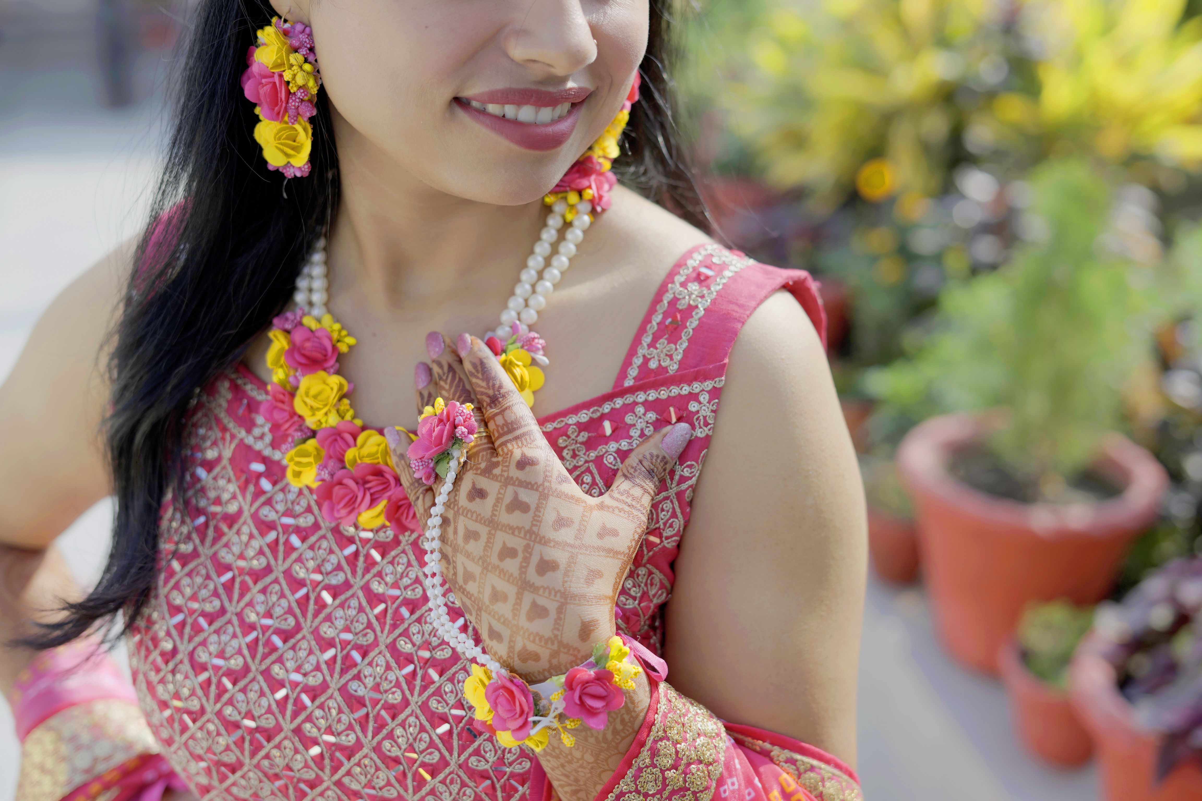Colorful Henna Adorned Woman in Traditional Dress · Free Stock Photo