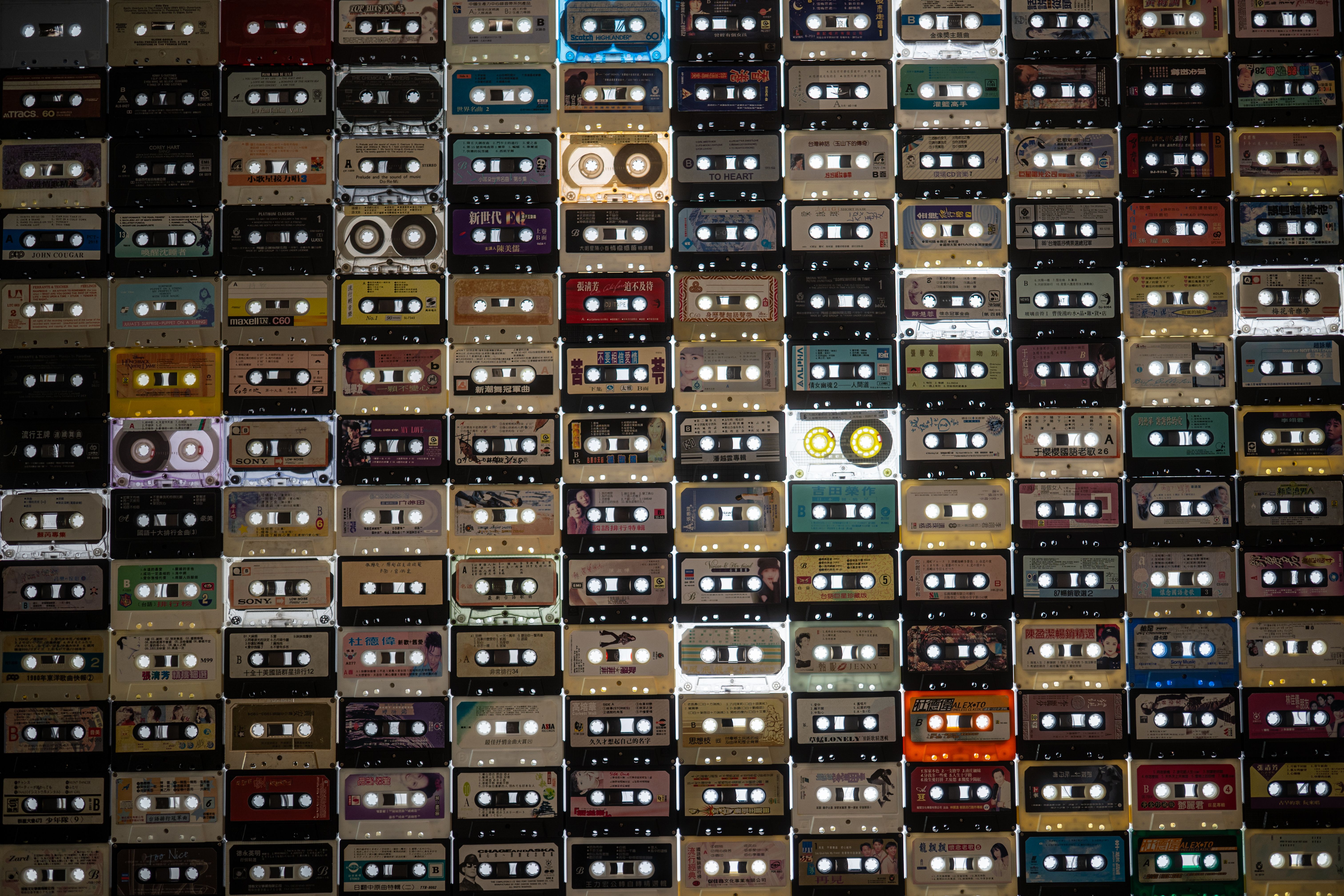 Vintage Cassette Tape Collection Wall Display · Free Stock Photo