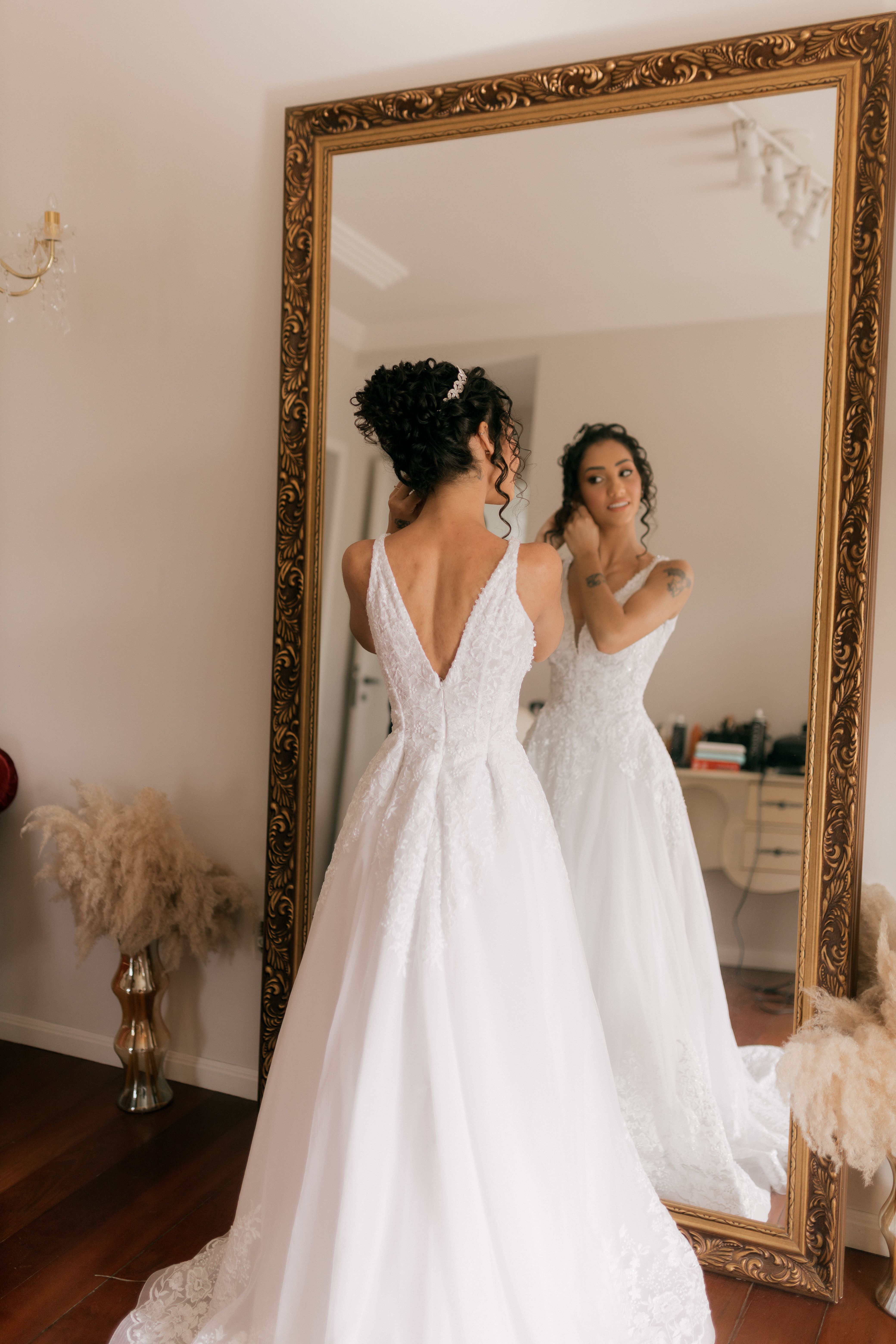 Elegant Bride Admiring Reflection in Mirror · Free Stock Photo