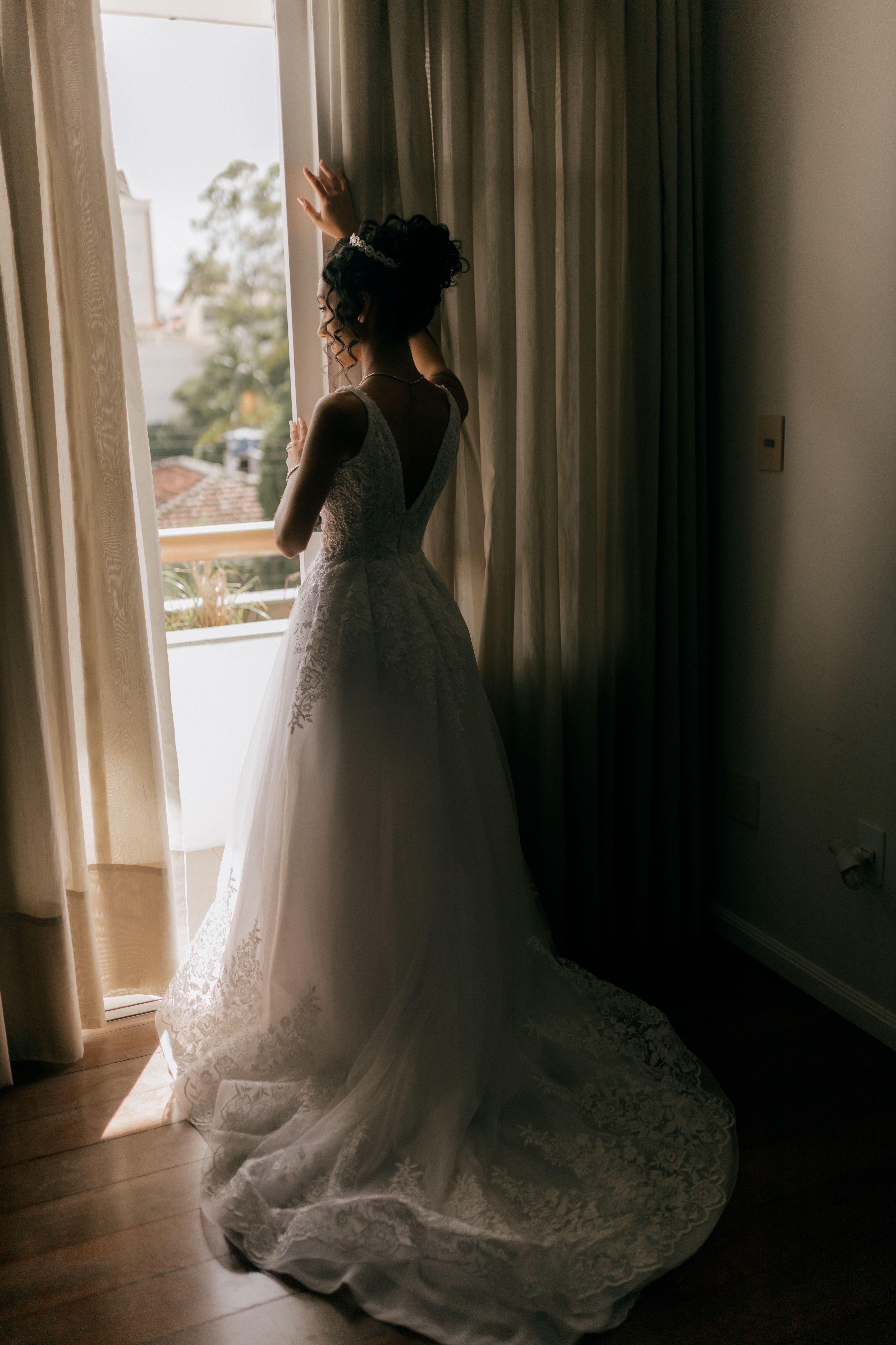 Bride Gazing Out Window in Wedding Dress · Free Stock Photo