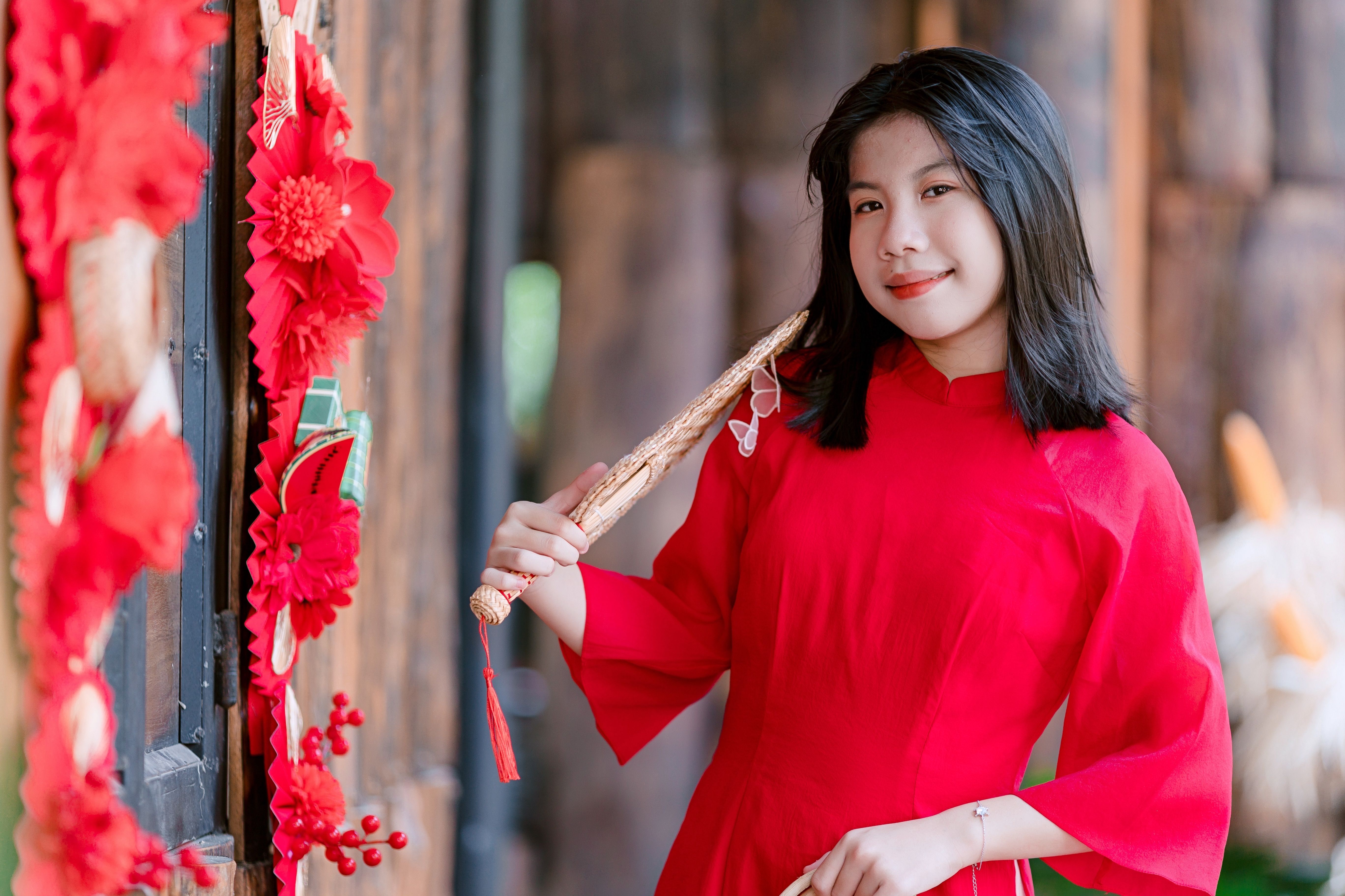 Young woman in red dress with festive decorations · Free Stock Photo