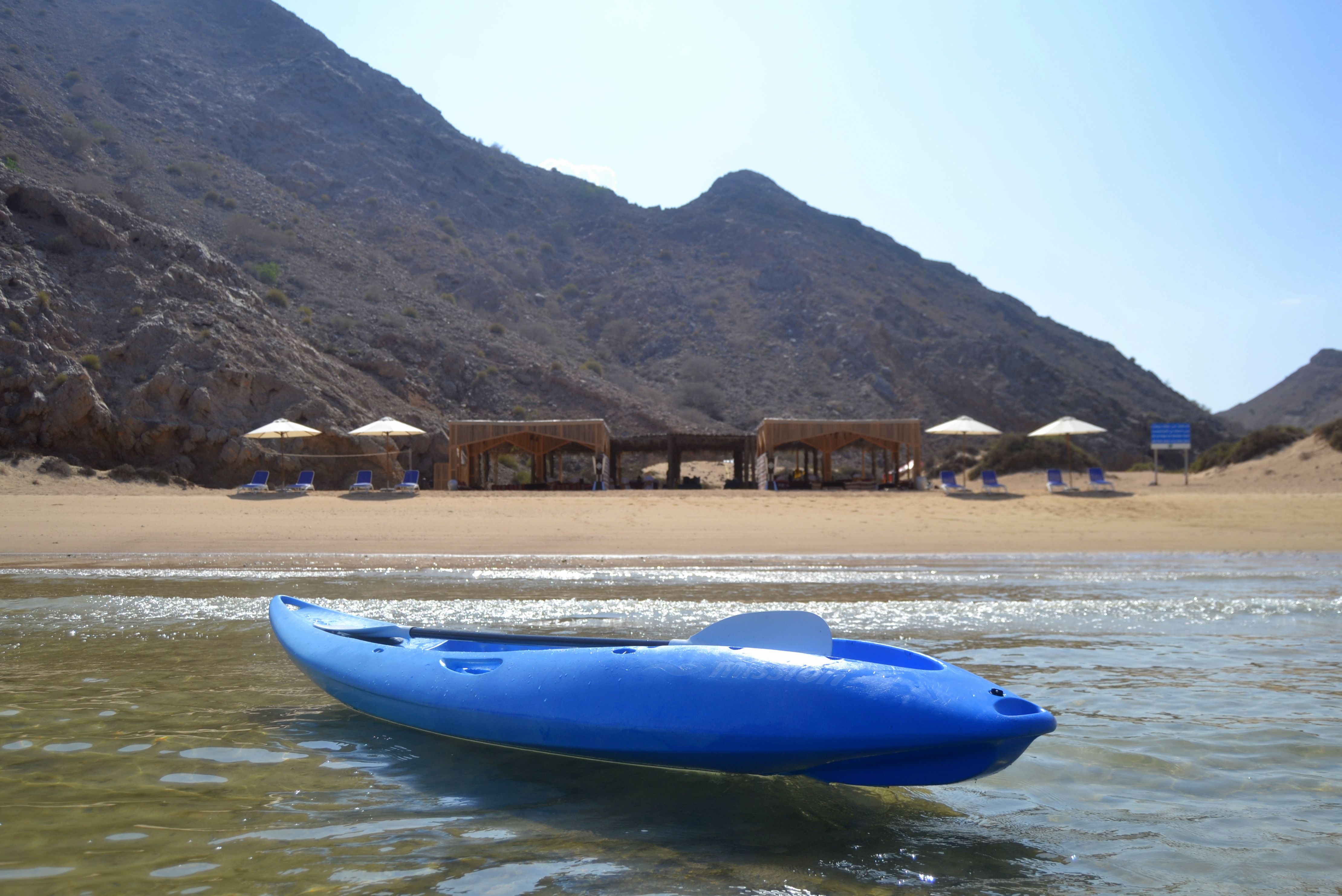 Serene Private Beach with Kayak in Oman · Free Stock Photo