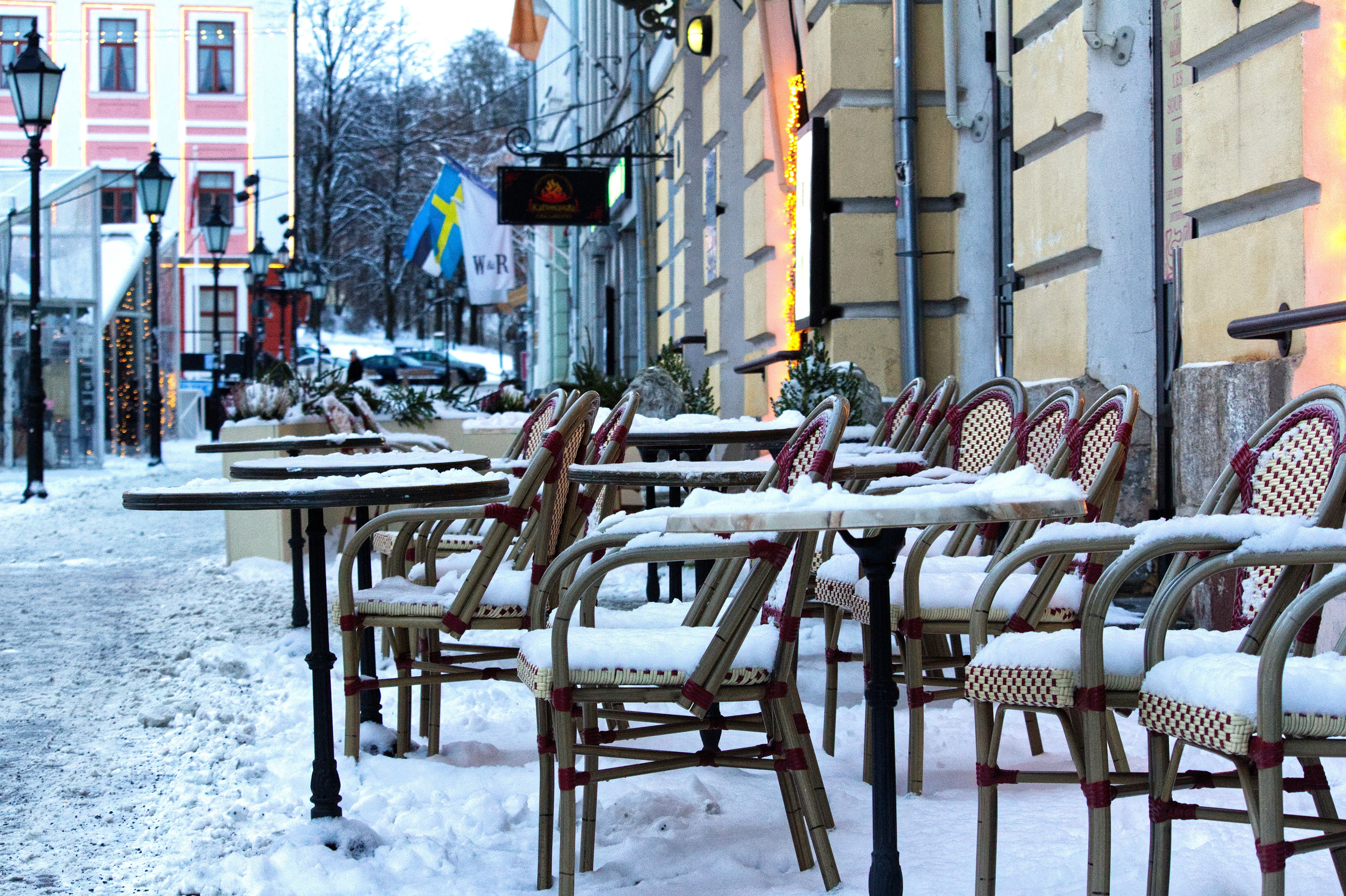 Snow-covered Outdoor Cafe in Winter Cityscape · Free Stock Photo