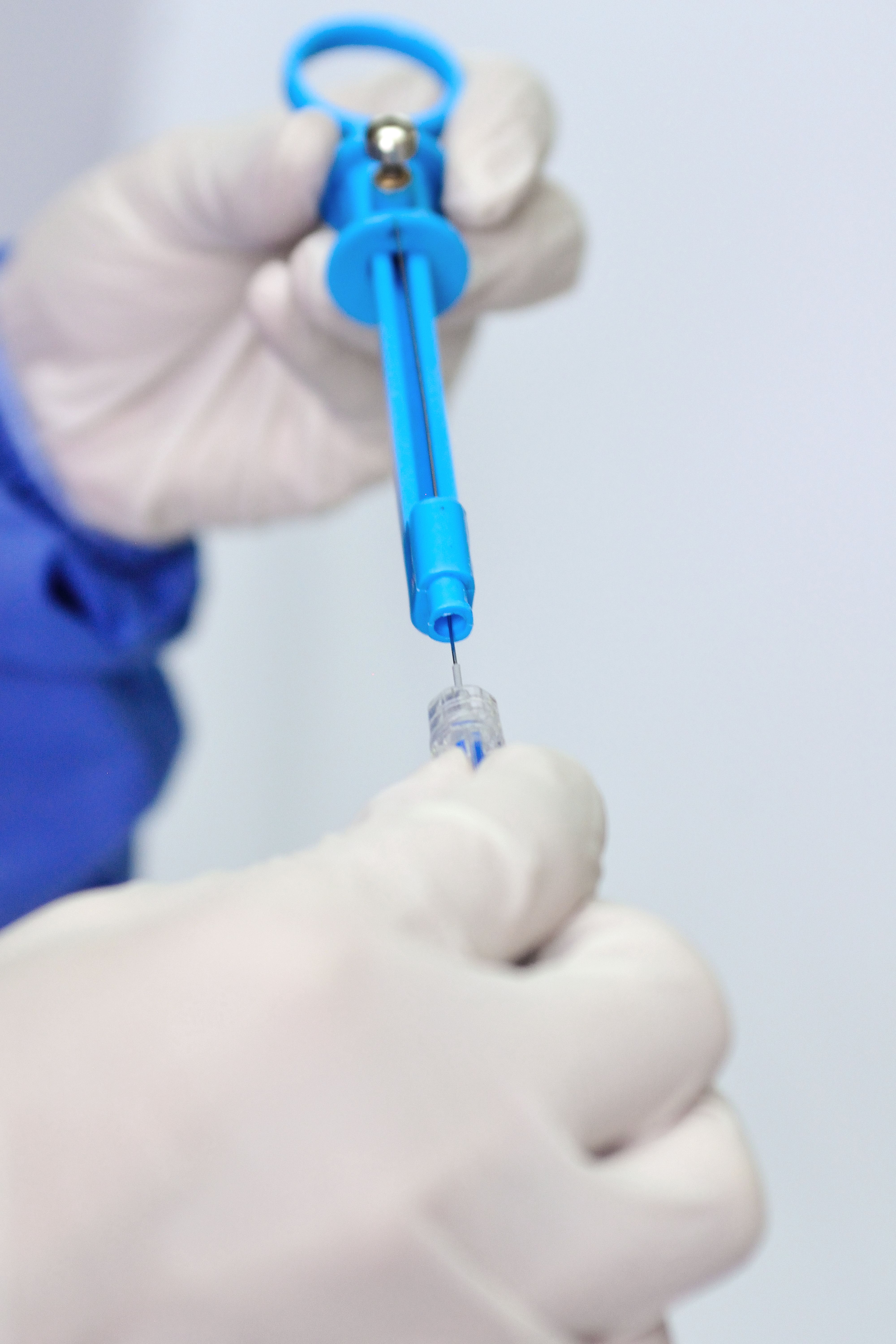 Medical Professional Preparing Syringe for Injection · Free Stock Photo