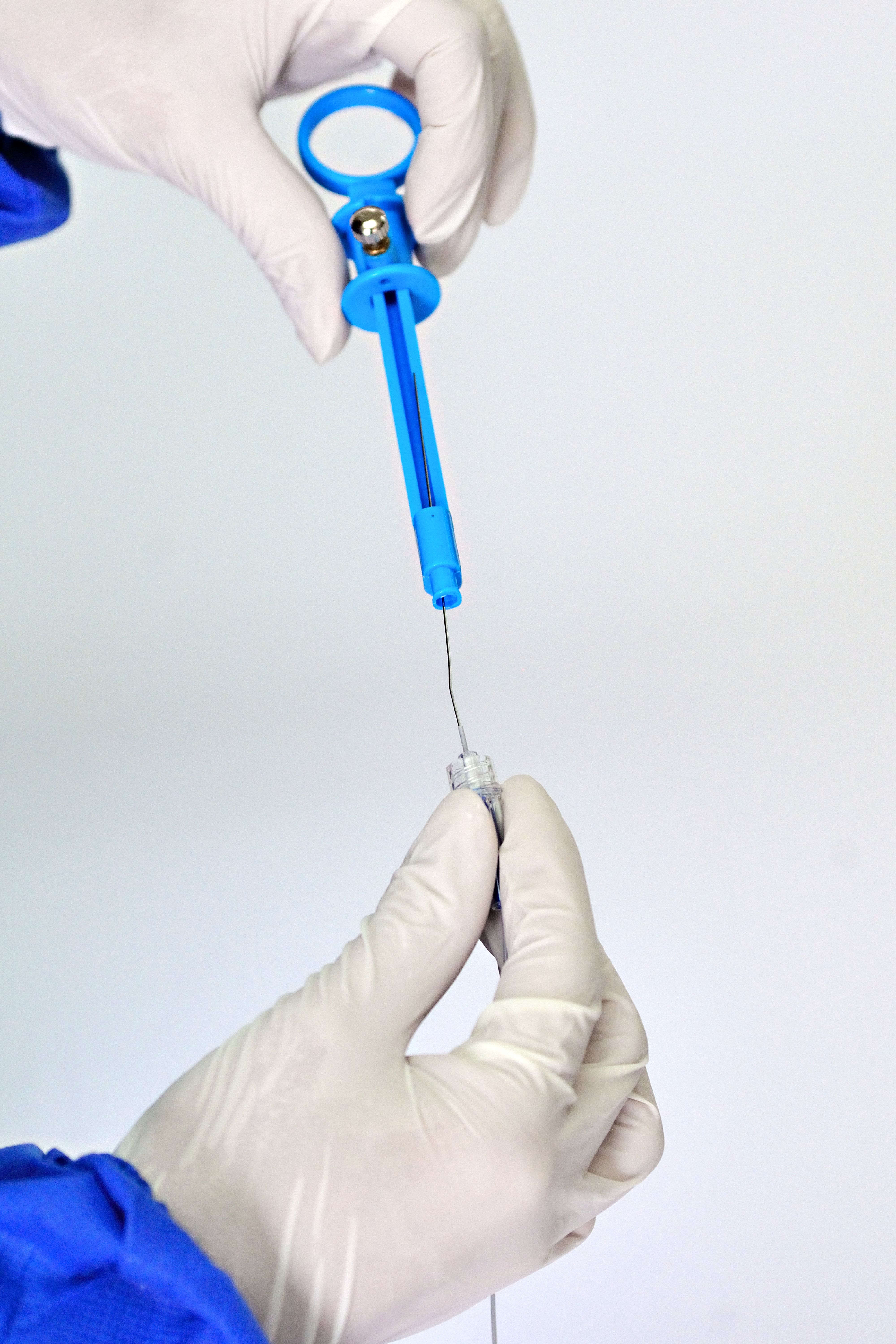 Medical Professional Preparing Needle for Procedure · Free Stock Photo