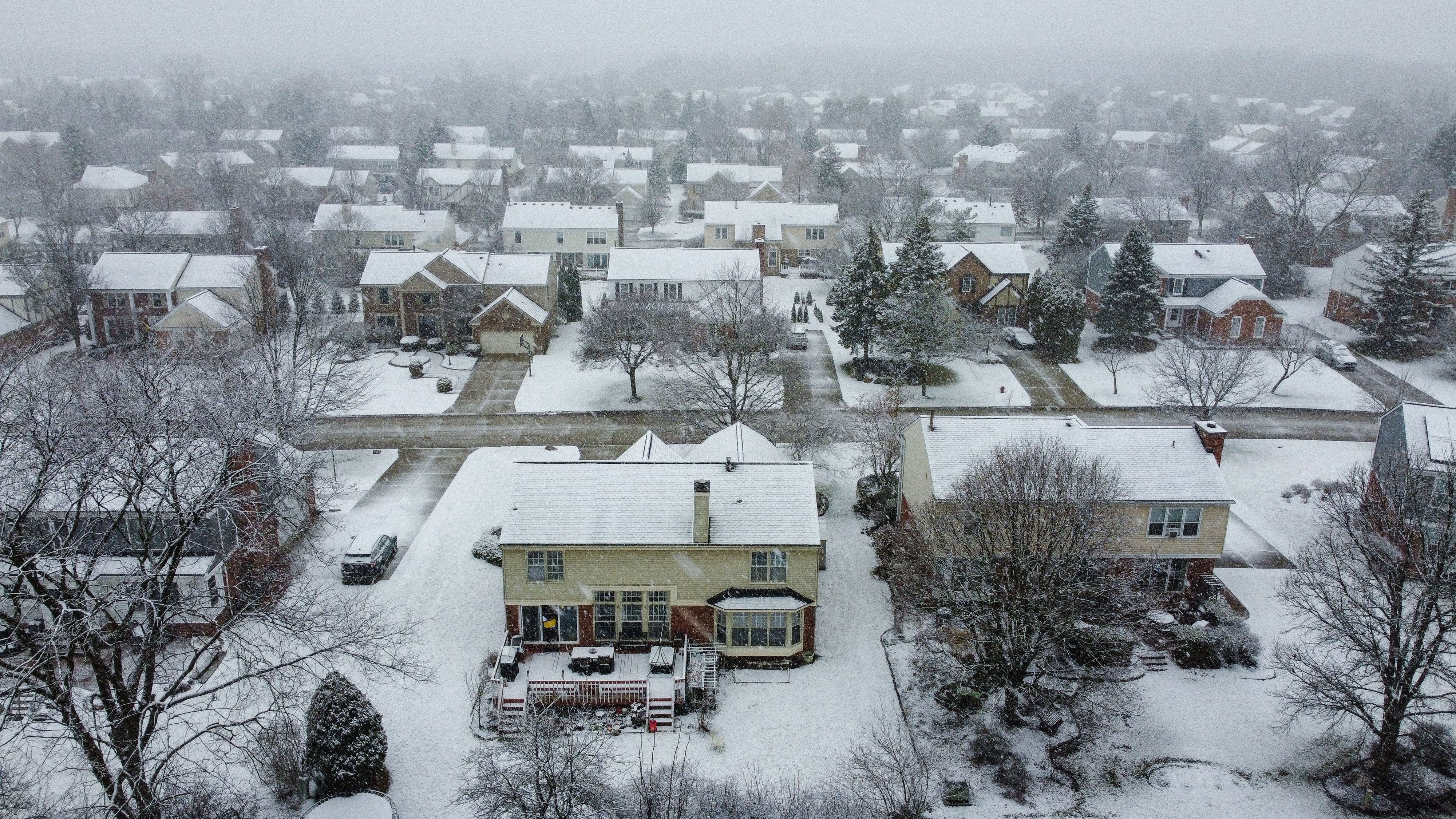 Aerial View of Suburban Neighborhood in Winter Snow · Free Stock Photo