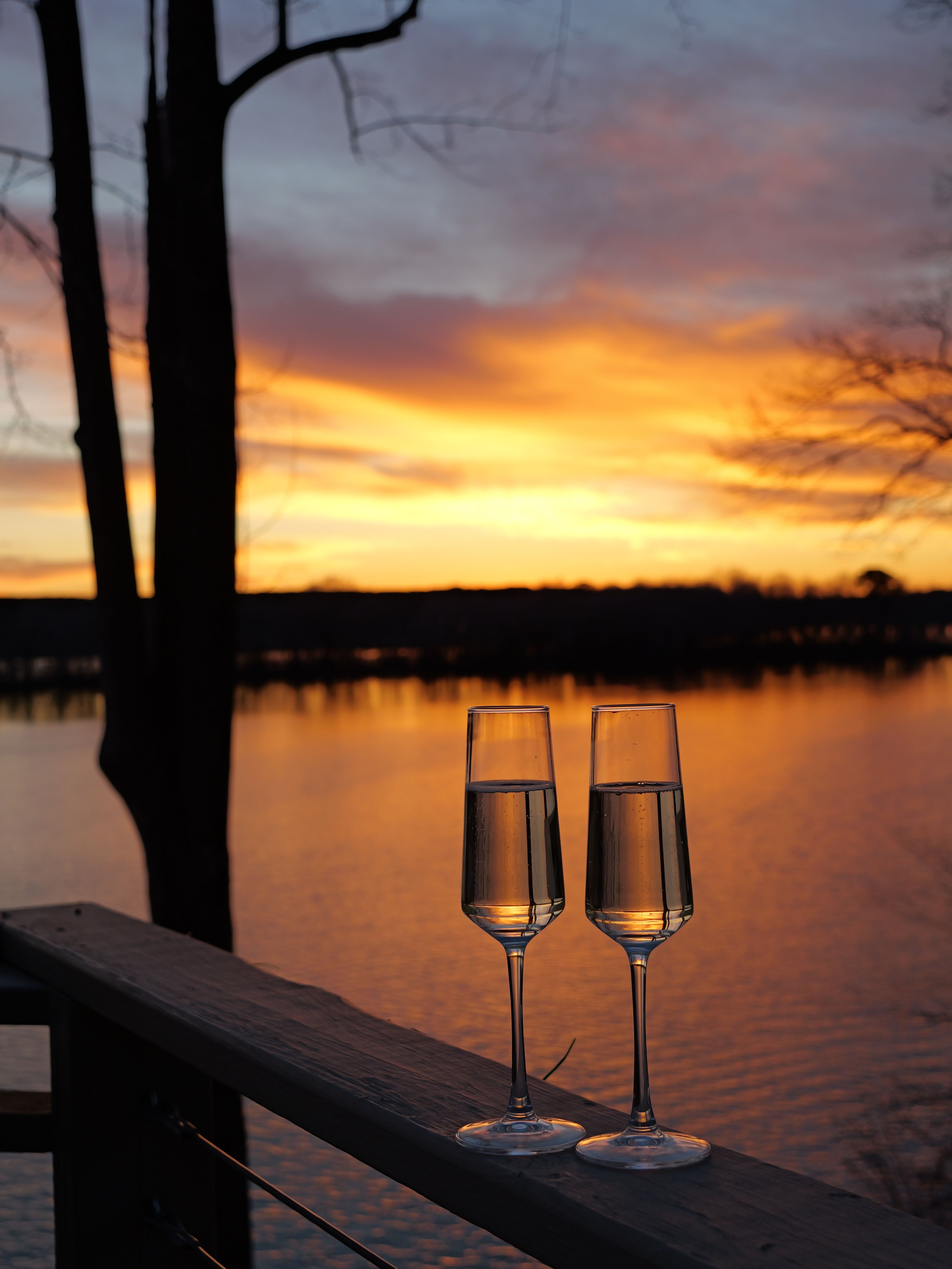 Romantic Sunset with Champagne Glasses on a Balcony · Free Stock Photo