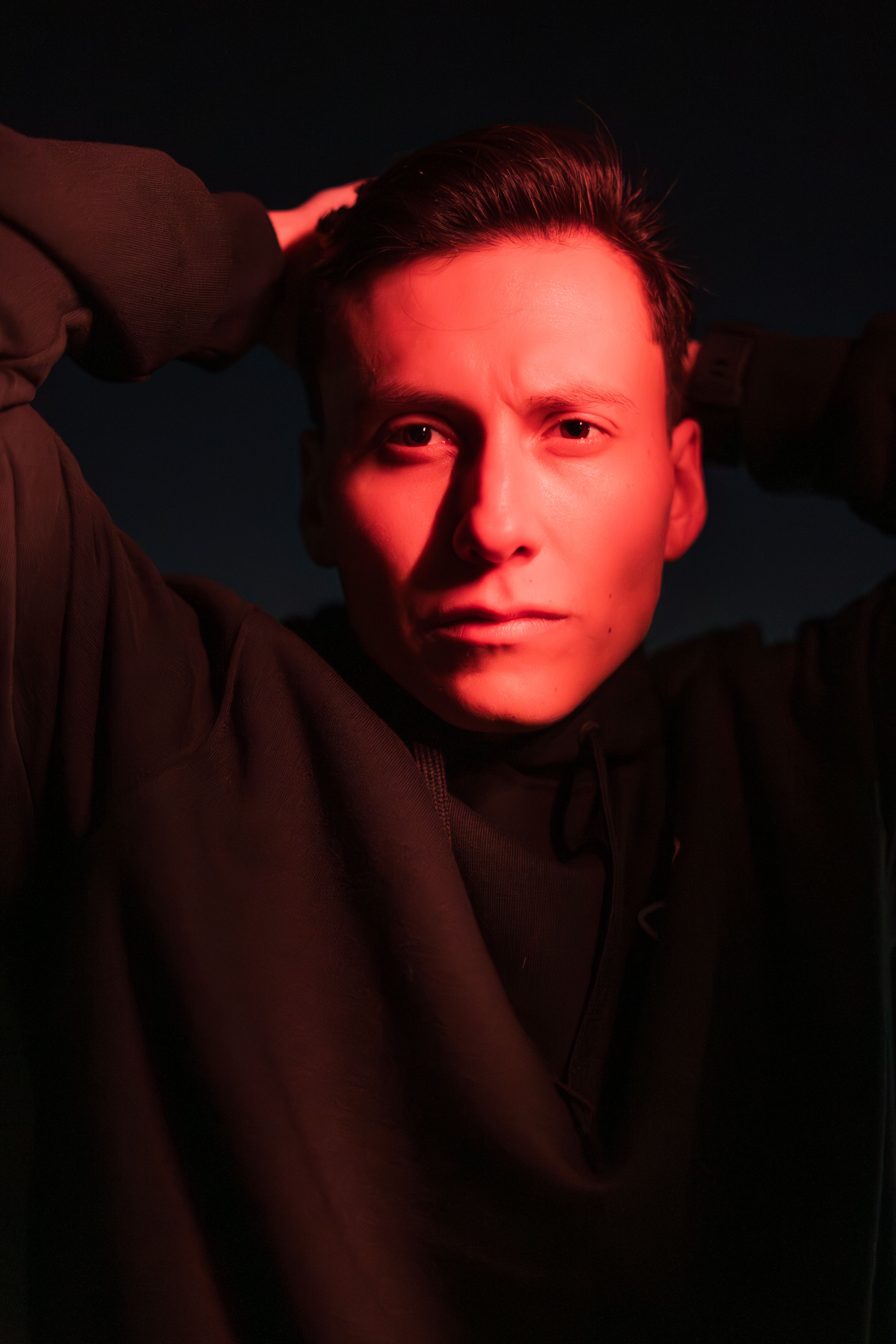 Moody Portrait with Dramatic Red Lighting Effect · Free Stock Photo