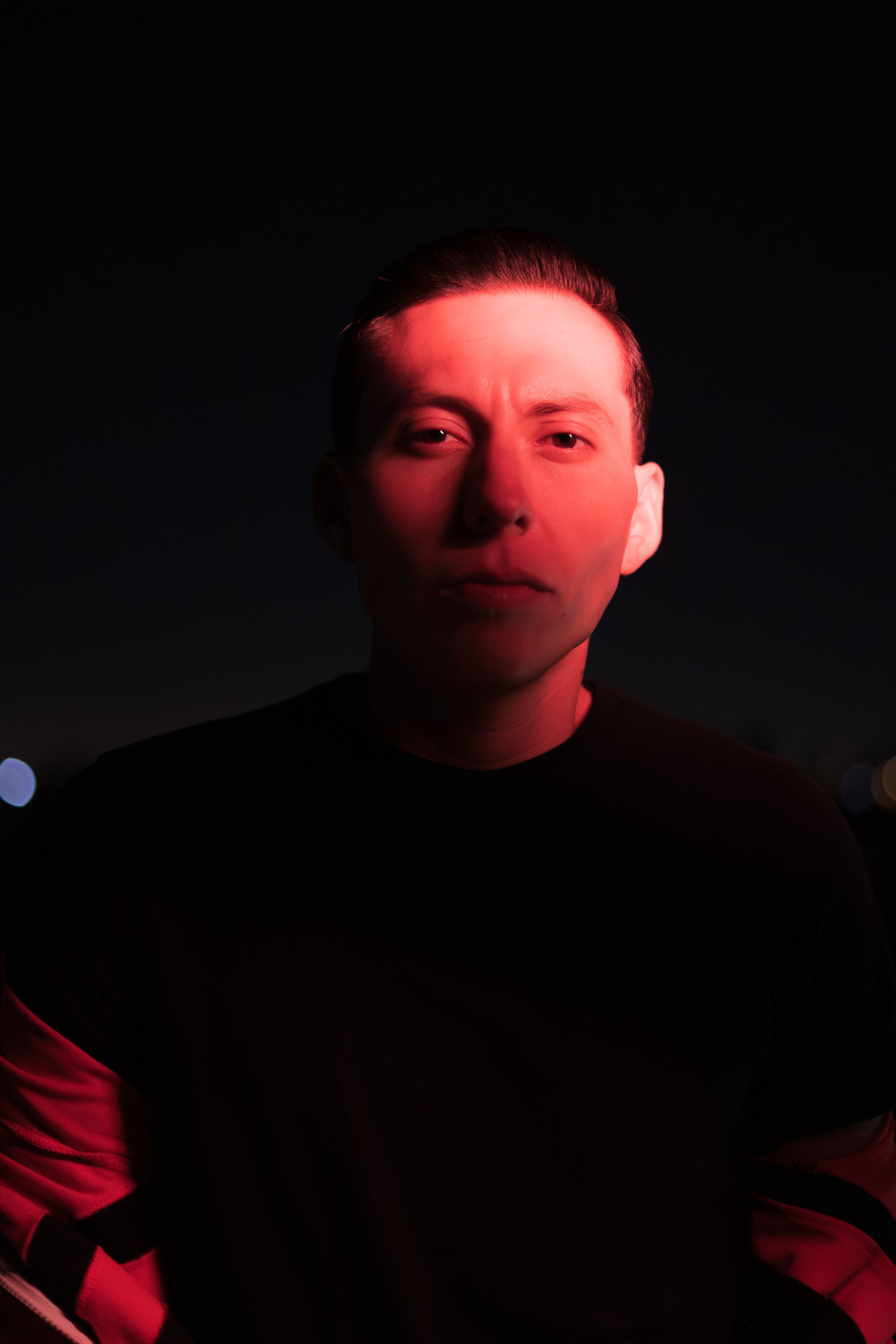 Moody Portrait with Red Lighting at Night · Free Stock Photo