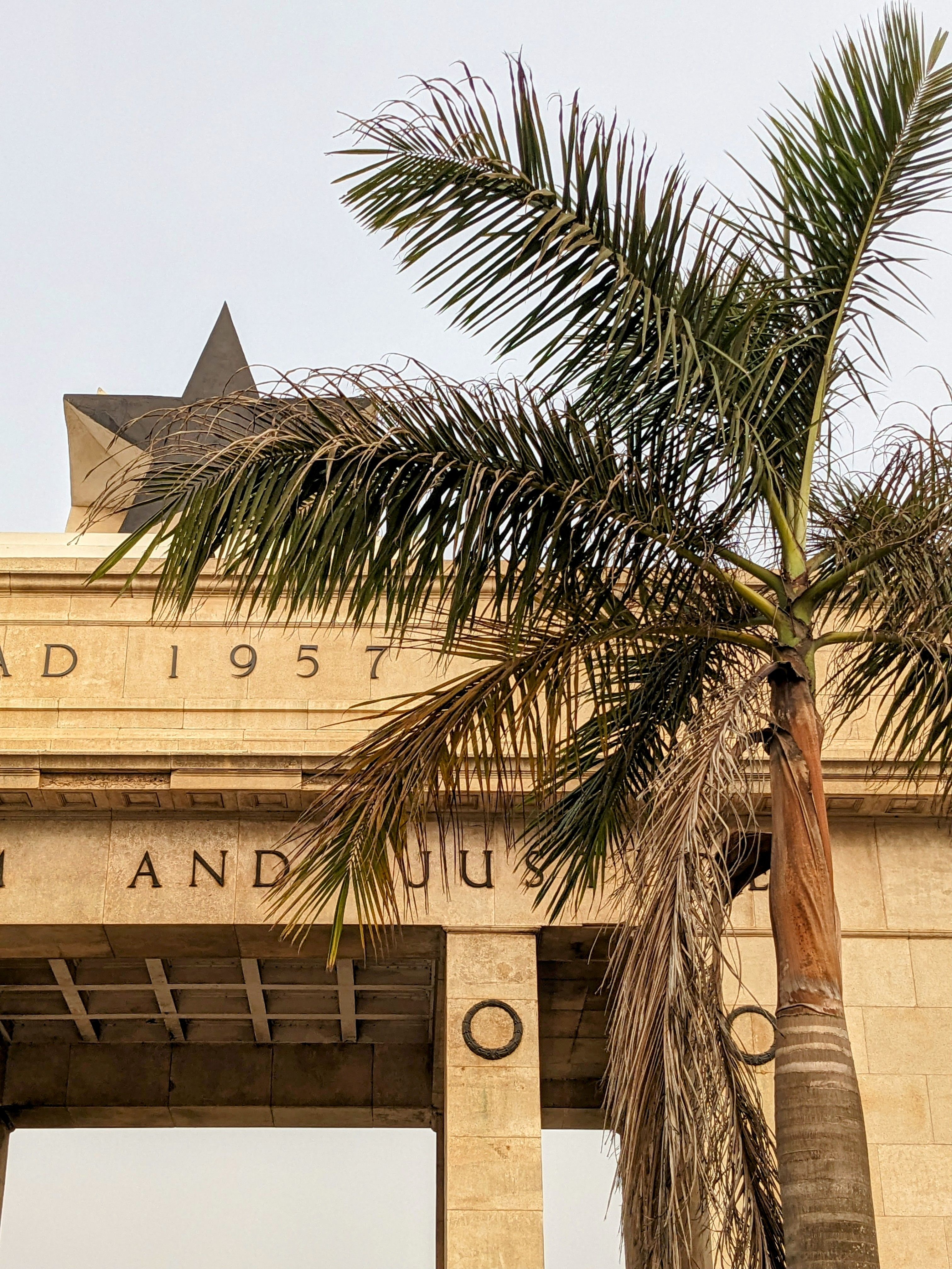 Independence Arch with Palm Tree in Accra · Free Stock Photo