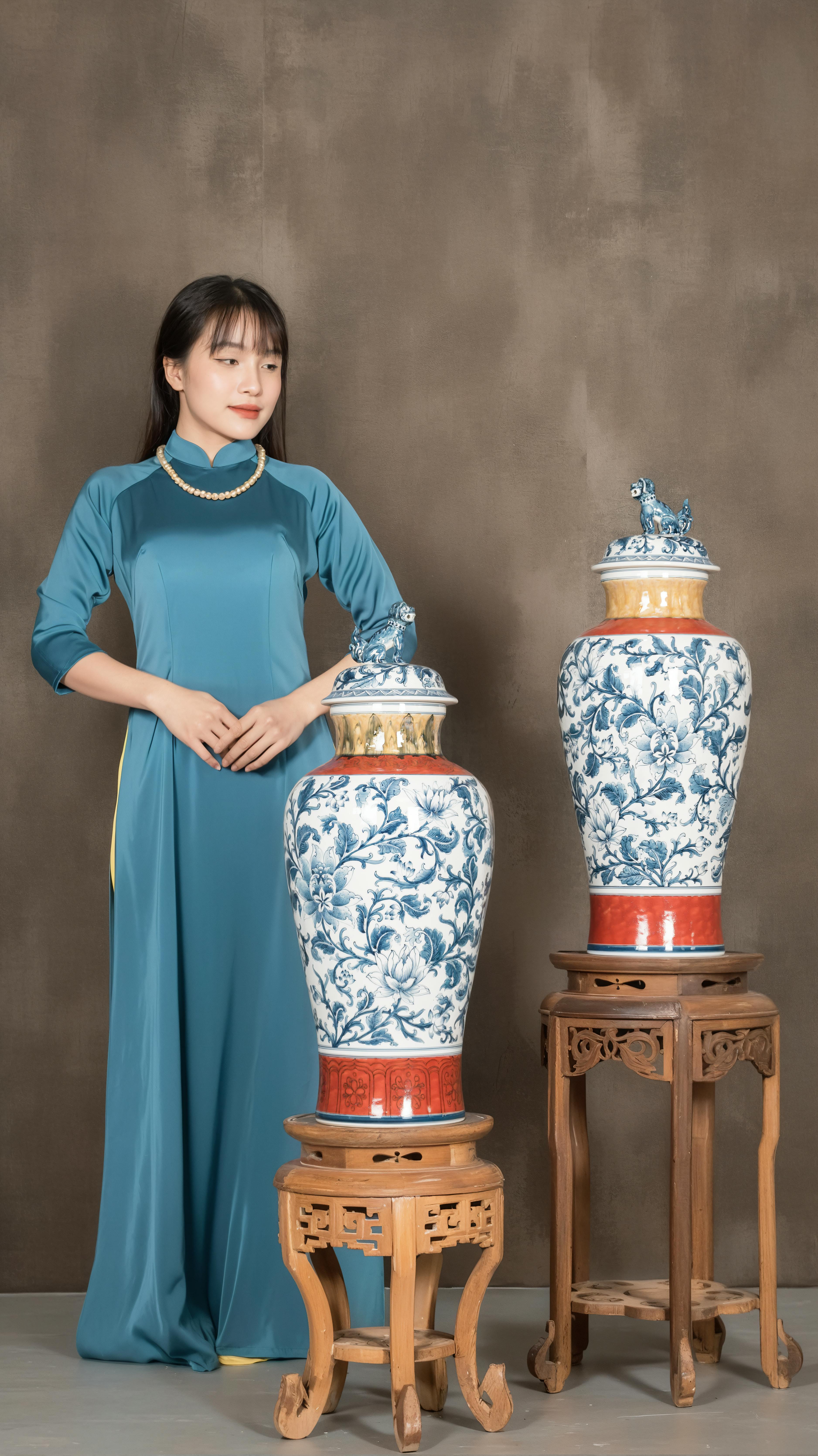 Elegant Asian Woman with Decorative Vases Indoors · Free Stock Photo