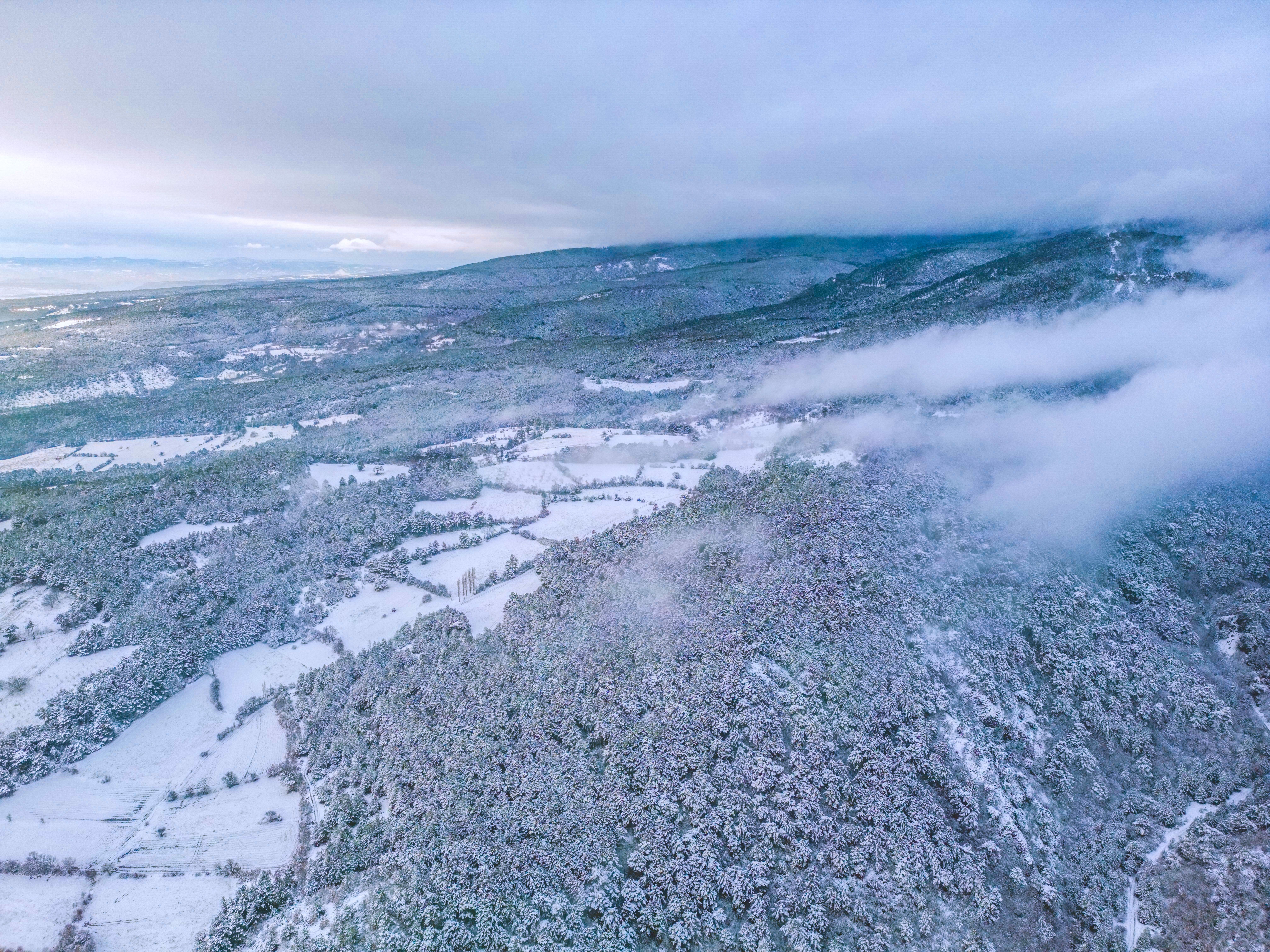 Aerial Winter Landscape of Snow-Covered Mountains · Free Stock Photo