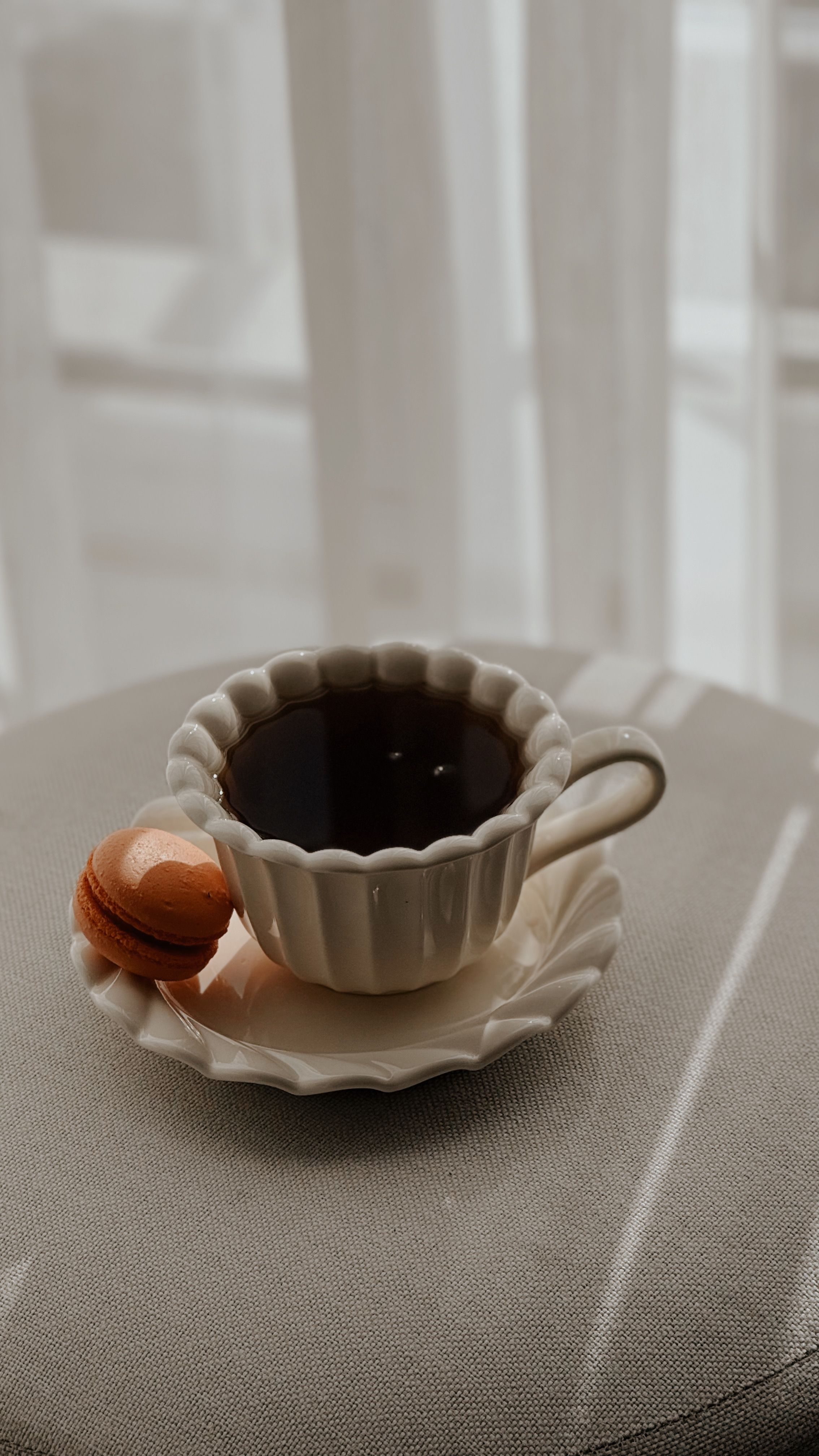 Elegant Coffee Cup with Macaron on Saucer · Free Stock Photo