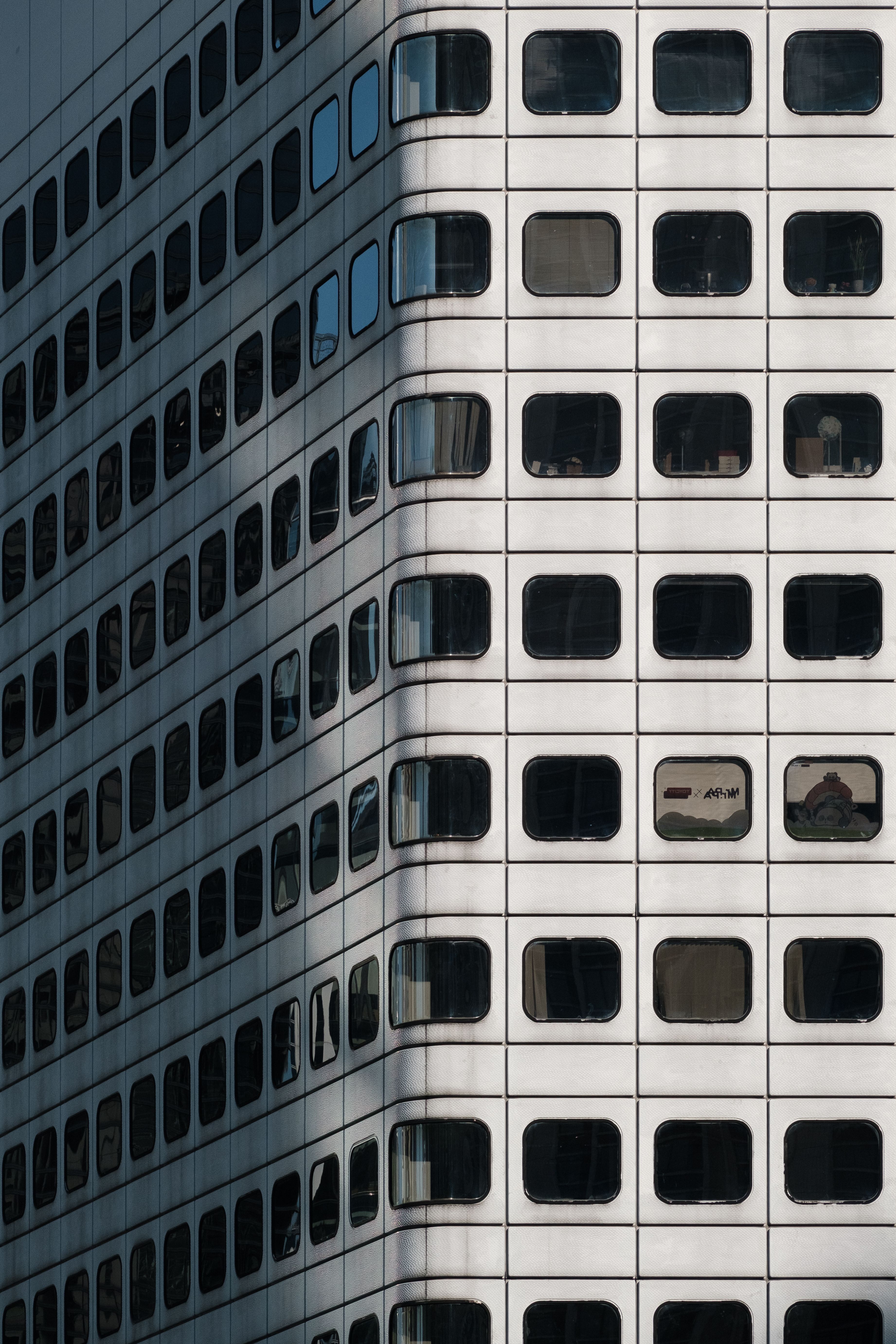 Modern Skyscraper with Unique Square Windows · Free Stock Photo