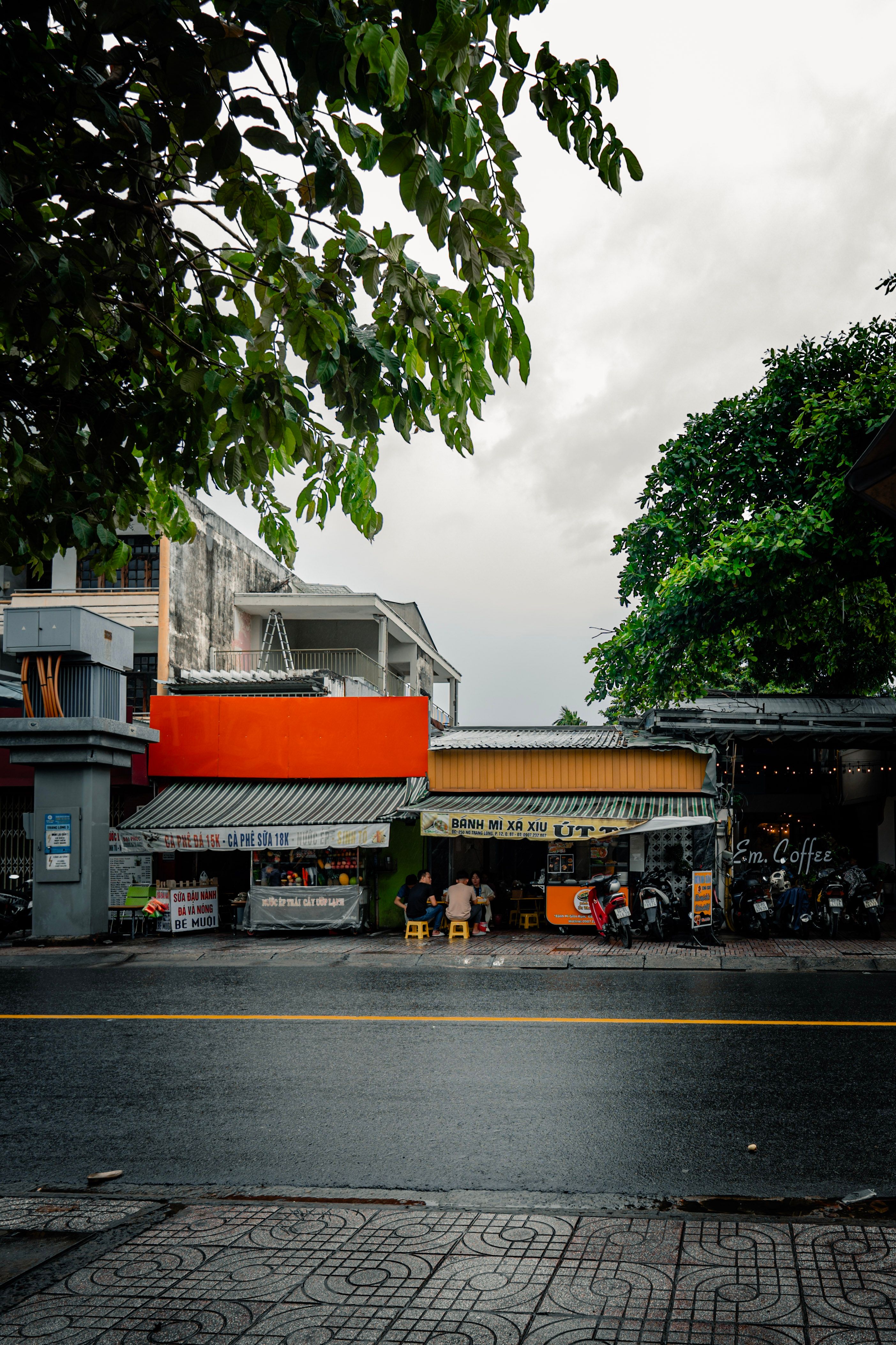 Vibrant Street Scene with Local Cafes and Shops · Free Stock Photo