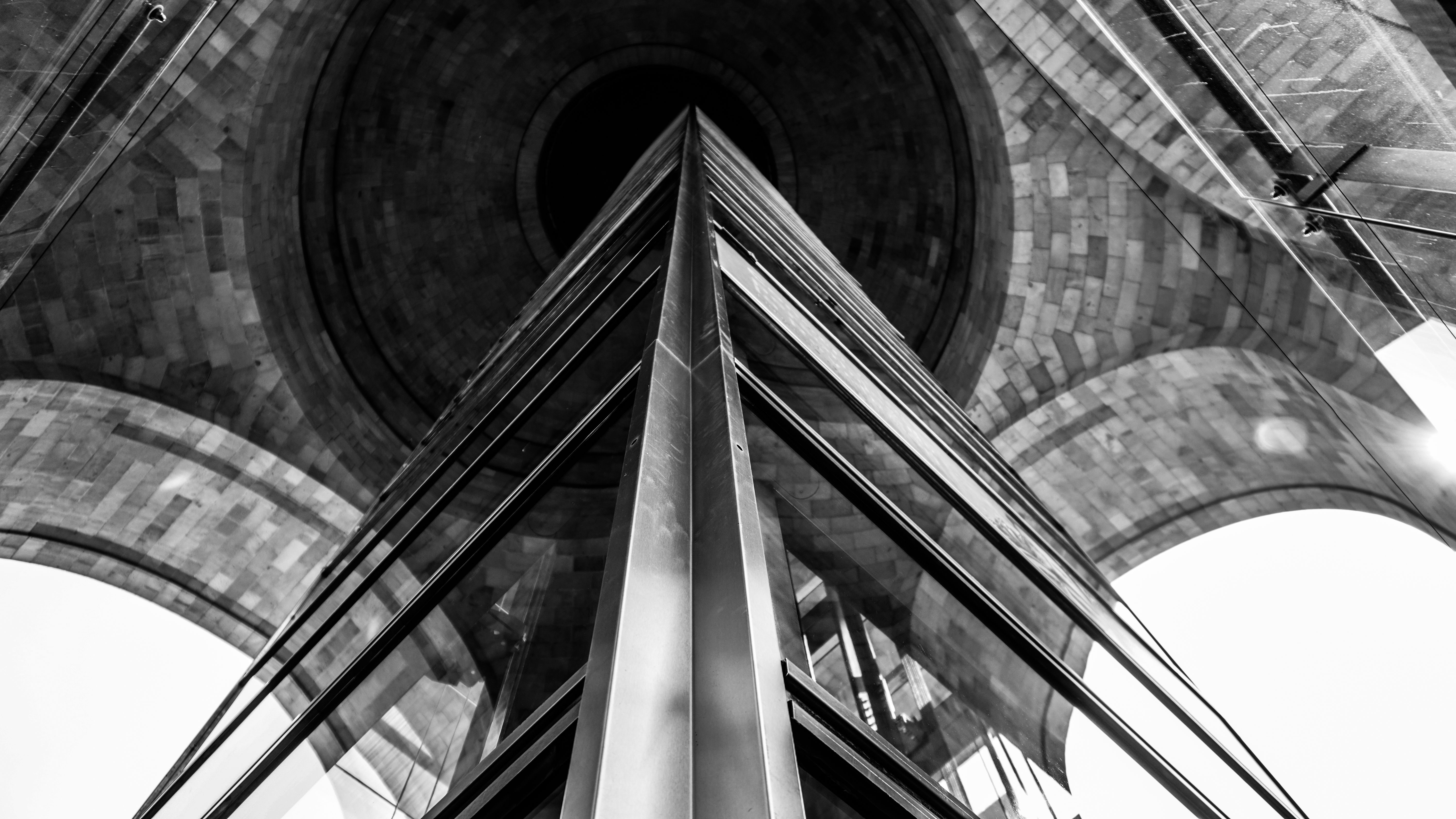 Modern architecture with glass and stone contrast · Free Stock Photo