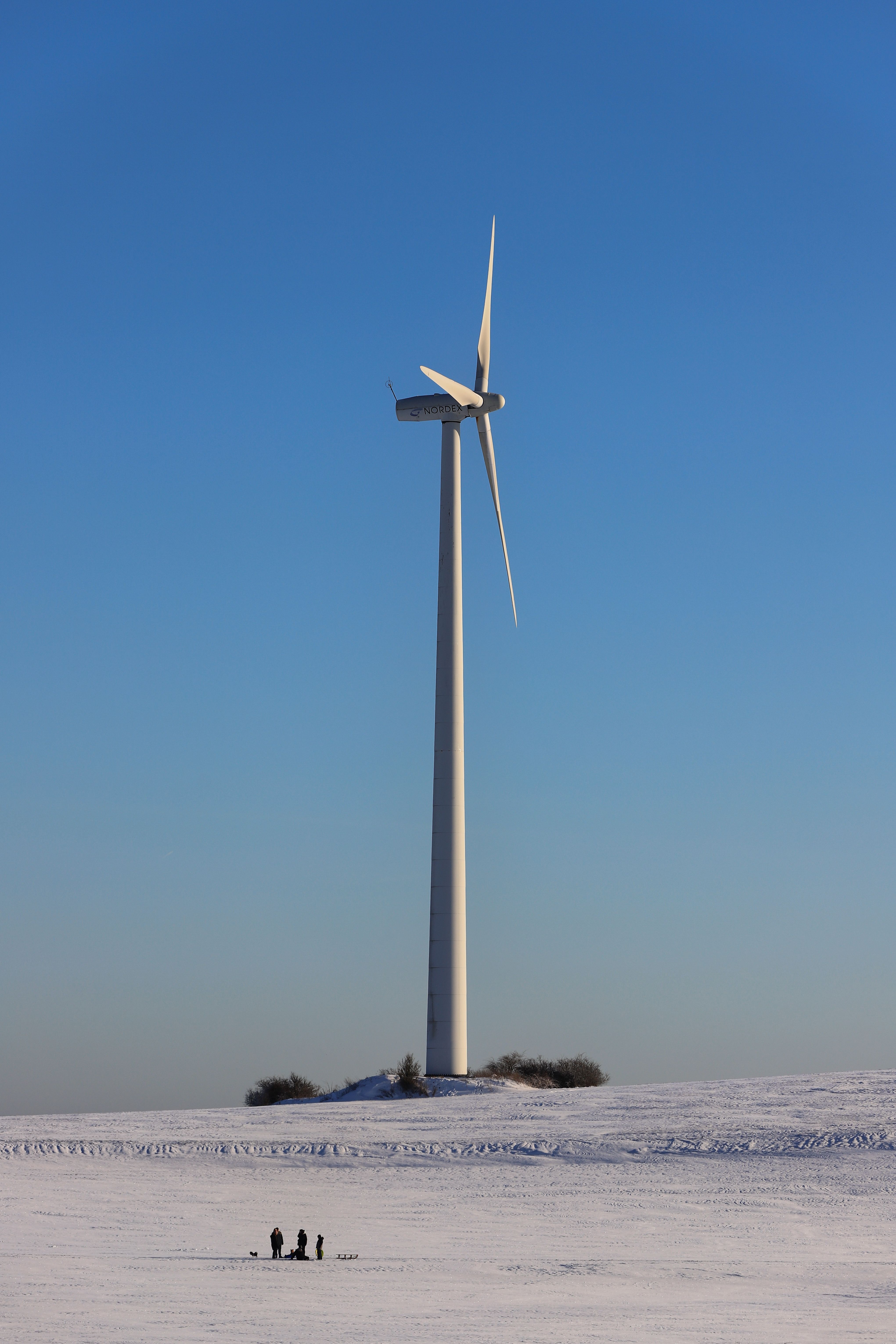 Wind Turbine in Snowy Winter Landscape · Free Stock Photo