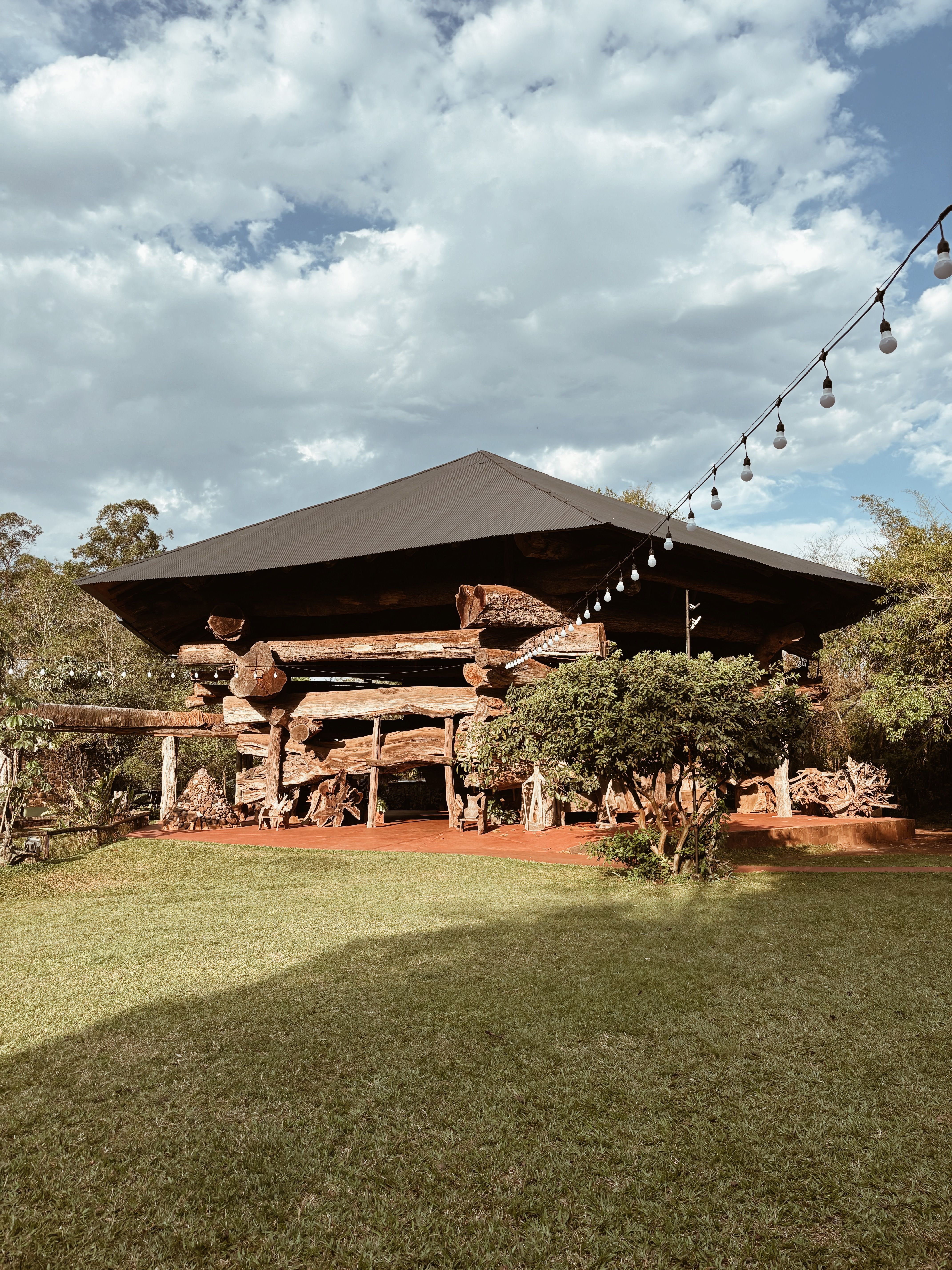 Rustic Wooden Pavilion with String Lights Outdoors · Free Stock Photo