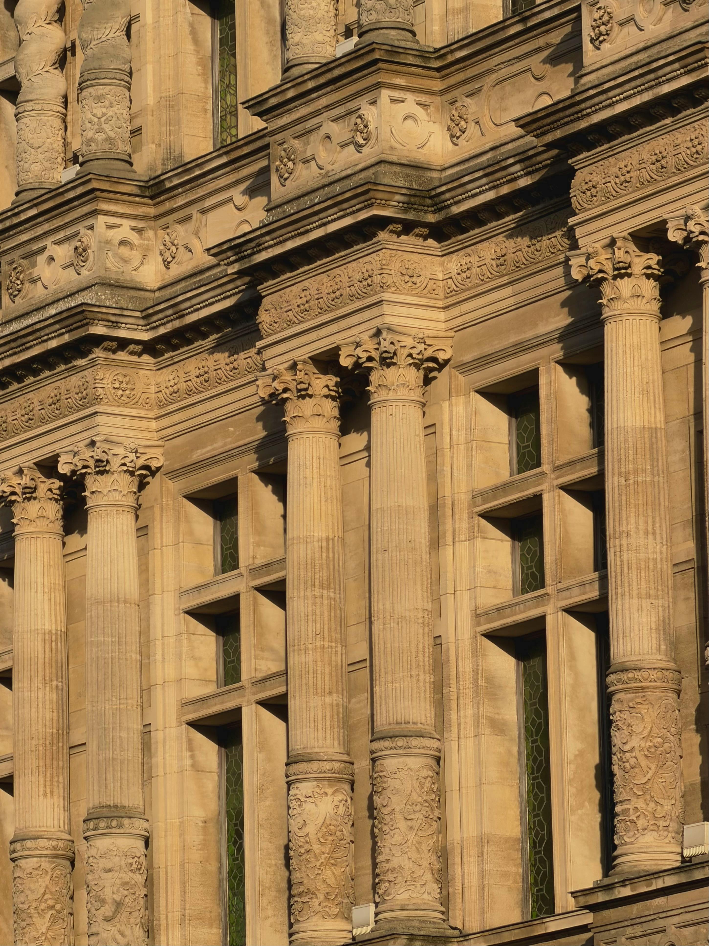 Ornate Classical Facade with Detailed Columns · Free Stock Photo